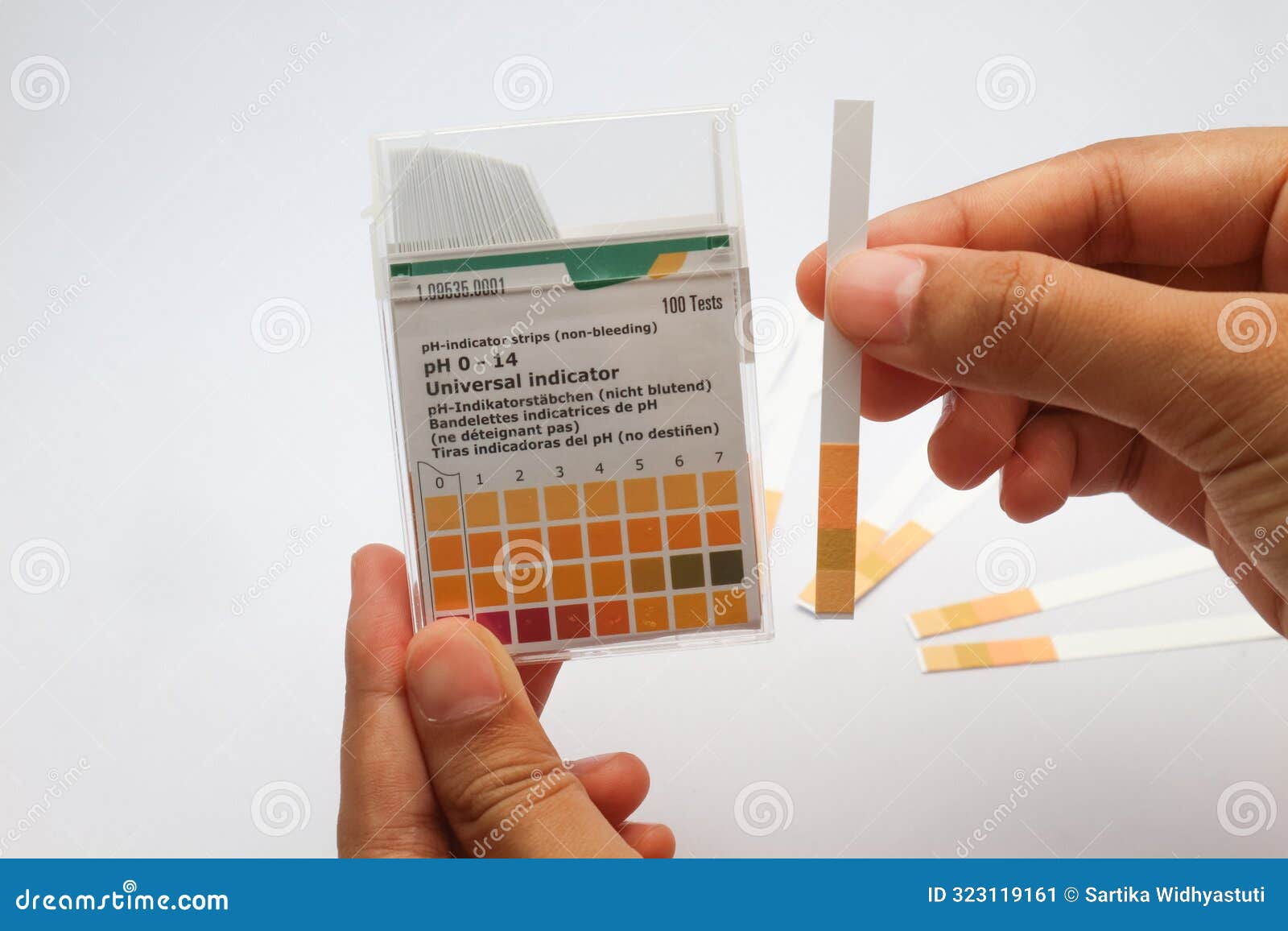 A Hand Holding PH Indicator Test Strips Indicates the Method of ...