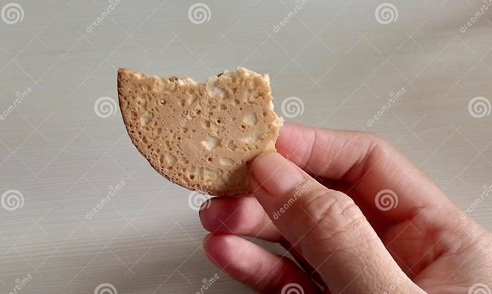 Hand Holding a Piece of Biscuit Stock Photo - Image of hand, biscuits ...