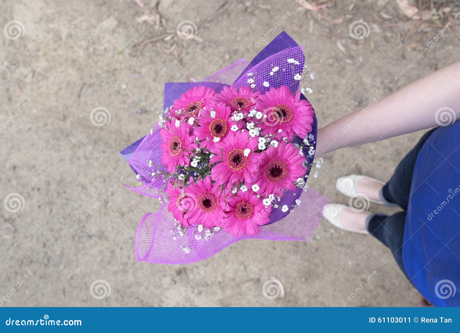 Hand holding pink flowers stock image. Image of romantic - 61103011