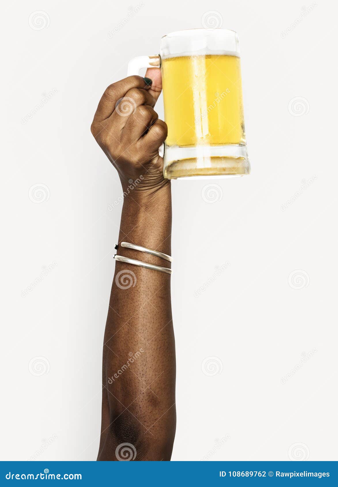 Hand holding pint of beer stock photo. Image of beer - 108689762