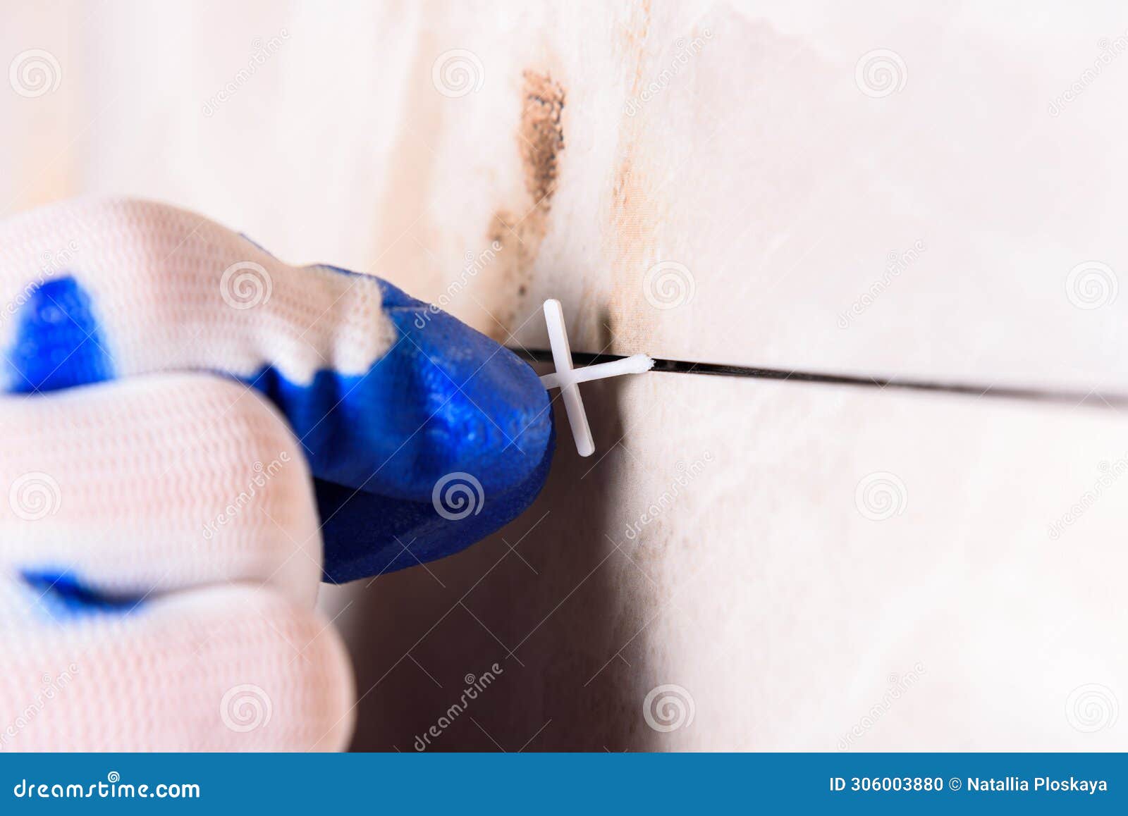 Hand Holding Plastic Crosses for Laying Ceramic Tiles. Stock Photo ...