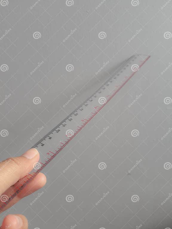A Hand is Holding a Plastic Ruler Stock Image - Image of industrial ...