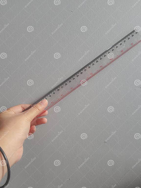 A Hand is Holding a Plastic Ruler Stock Photo - Image of geometric ...