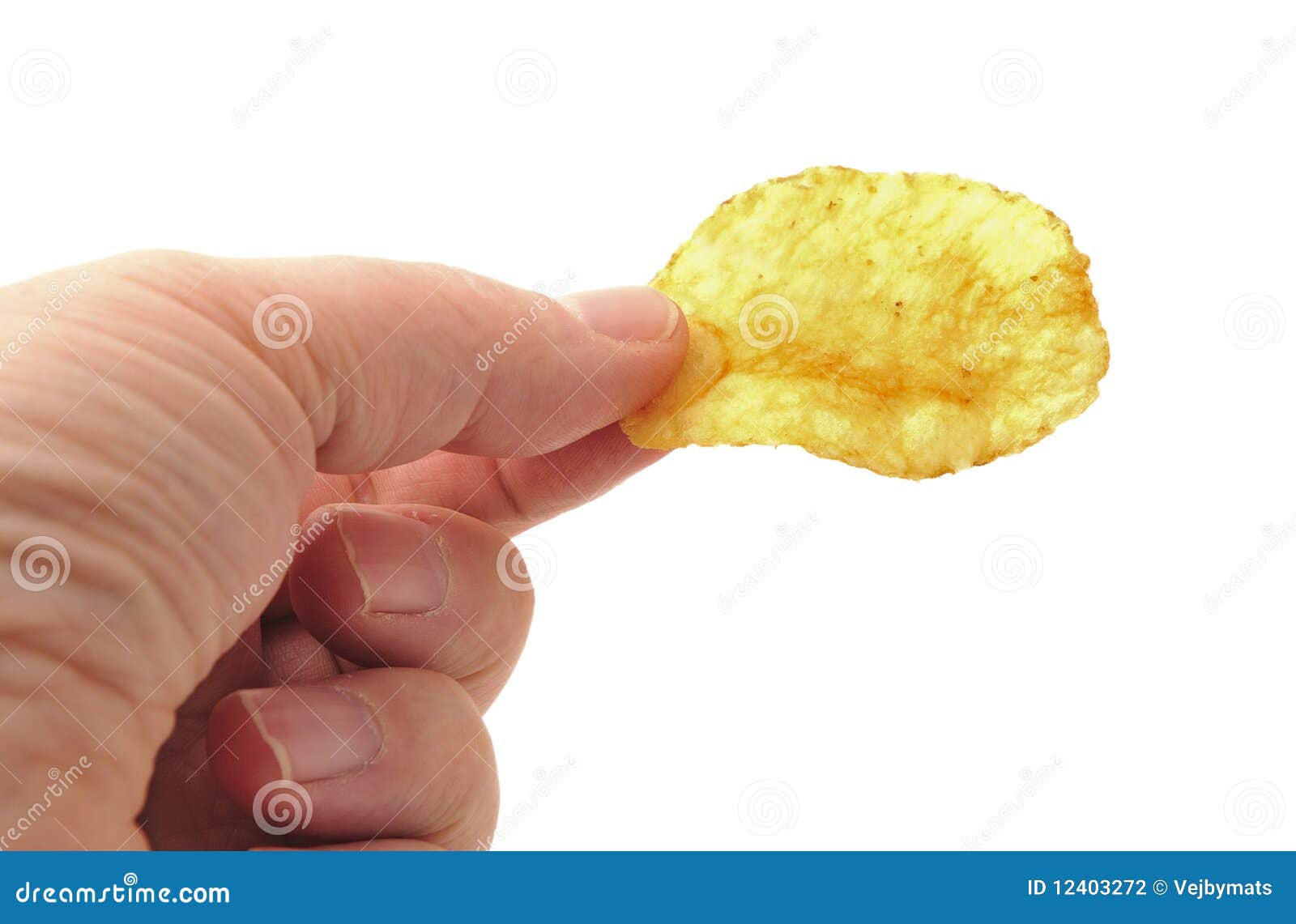 Hand holding a potato chip stock photo. Image of food - 12403272