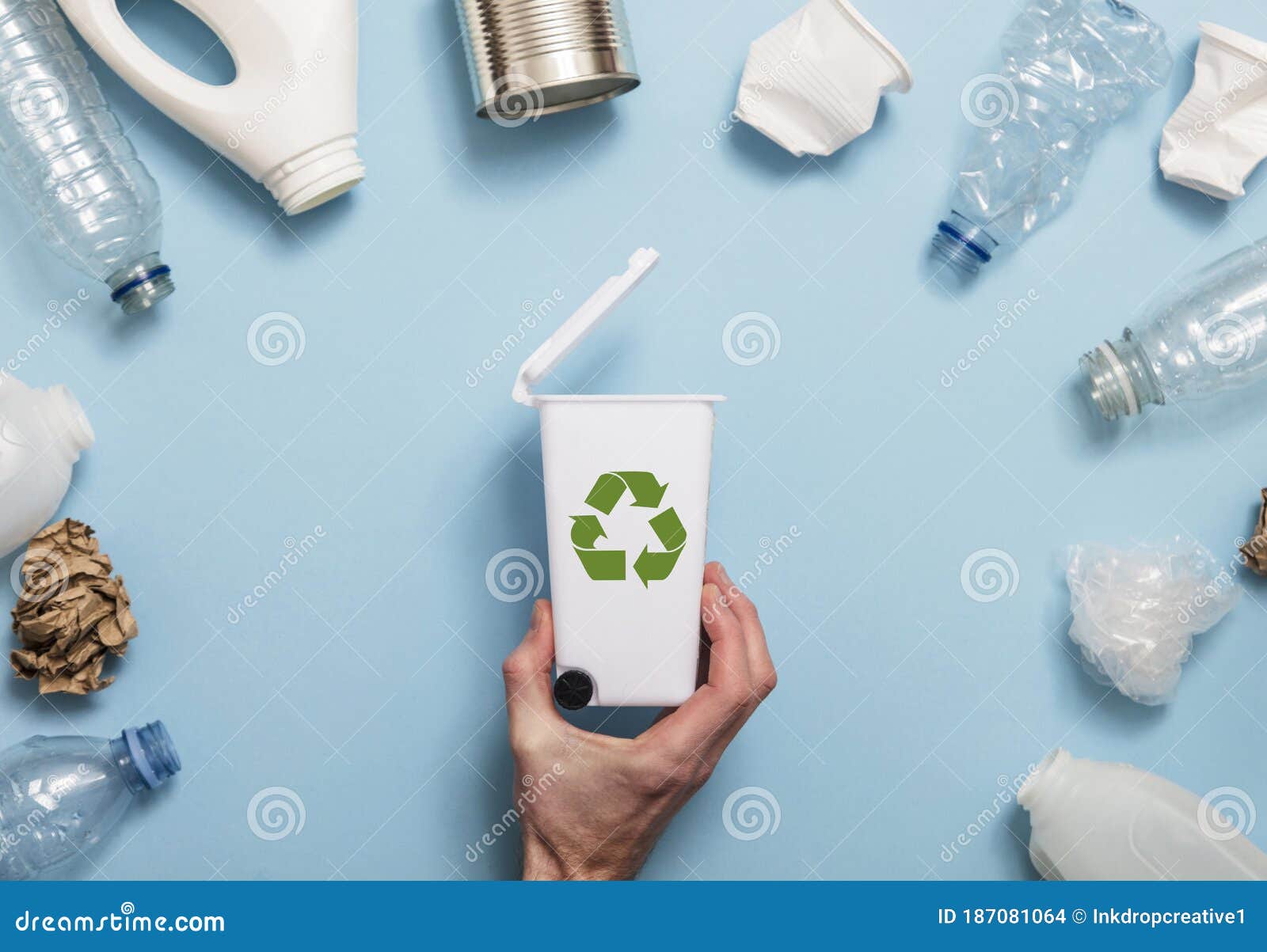 Hand Holding a Recycling Garbage Bin with Lots of Waste Packaging Stock ...