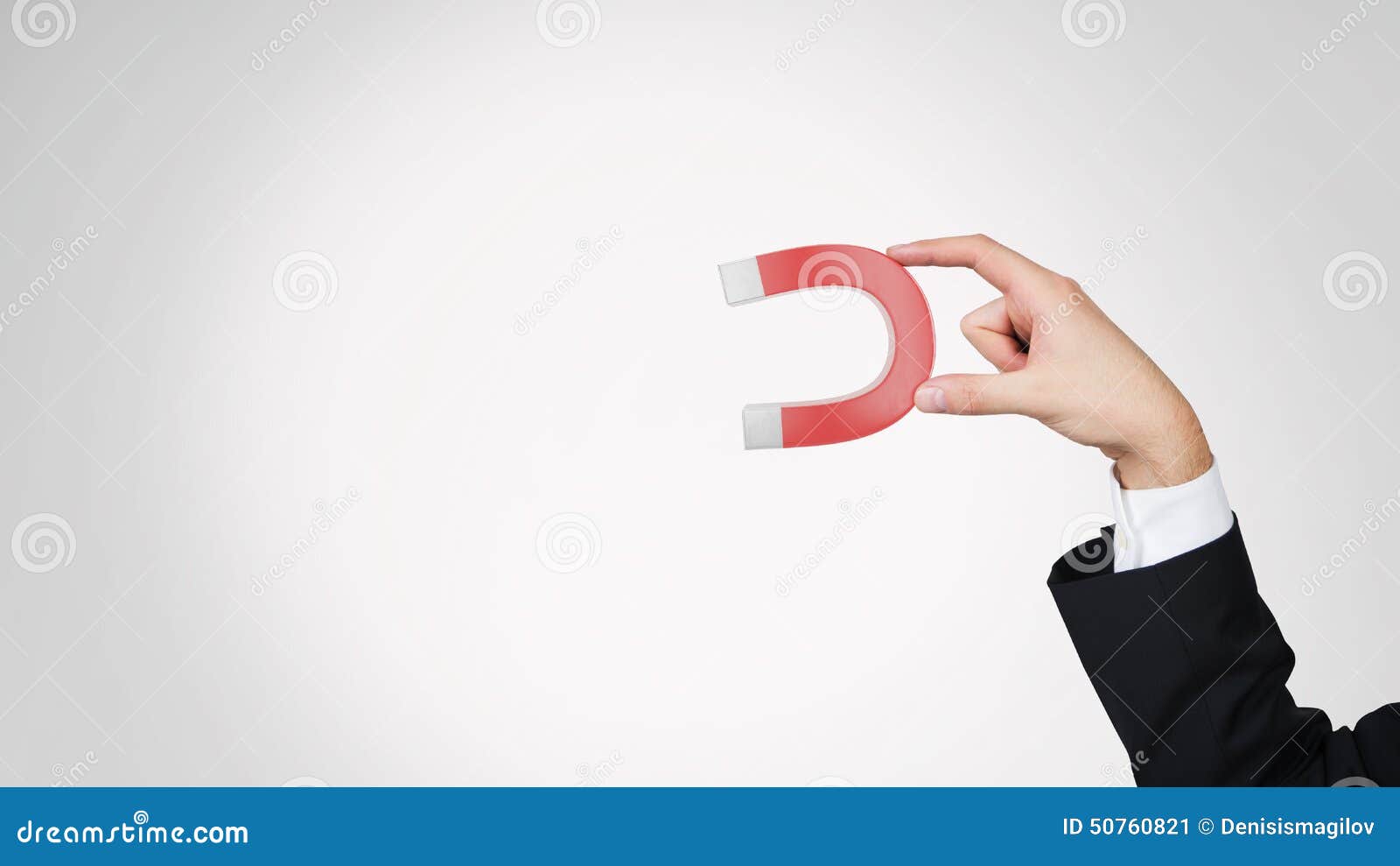 Hand holding red magnet stock image. Image of dragging - 50760821