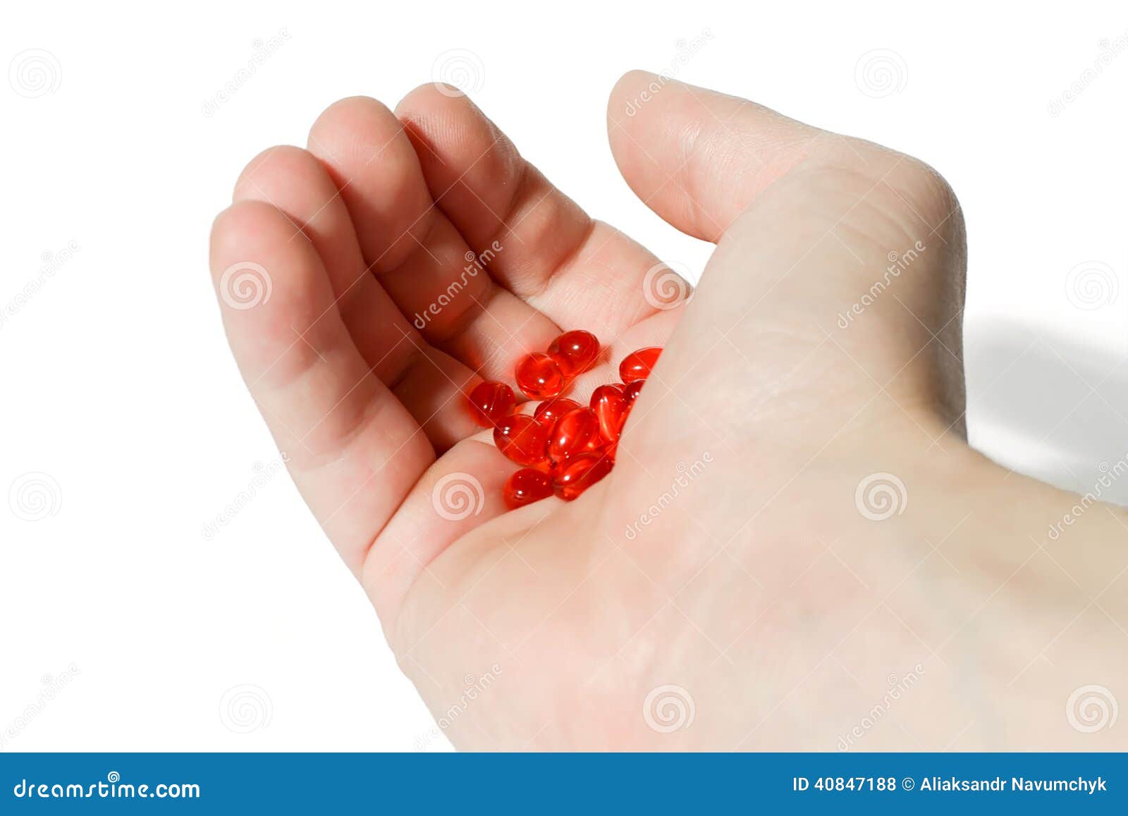 Hand holding red pills stock photo. Image of medication - 40847188