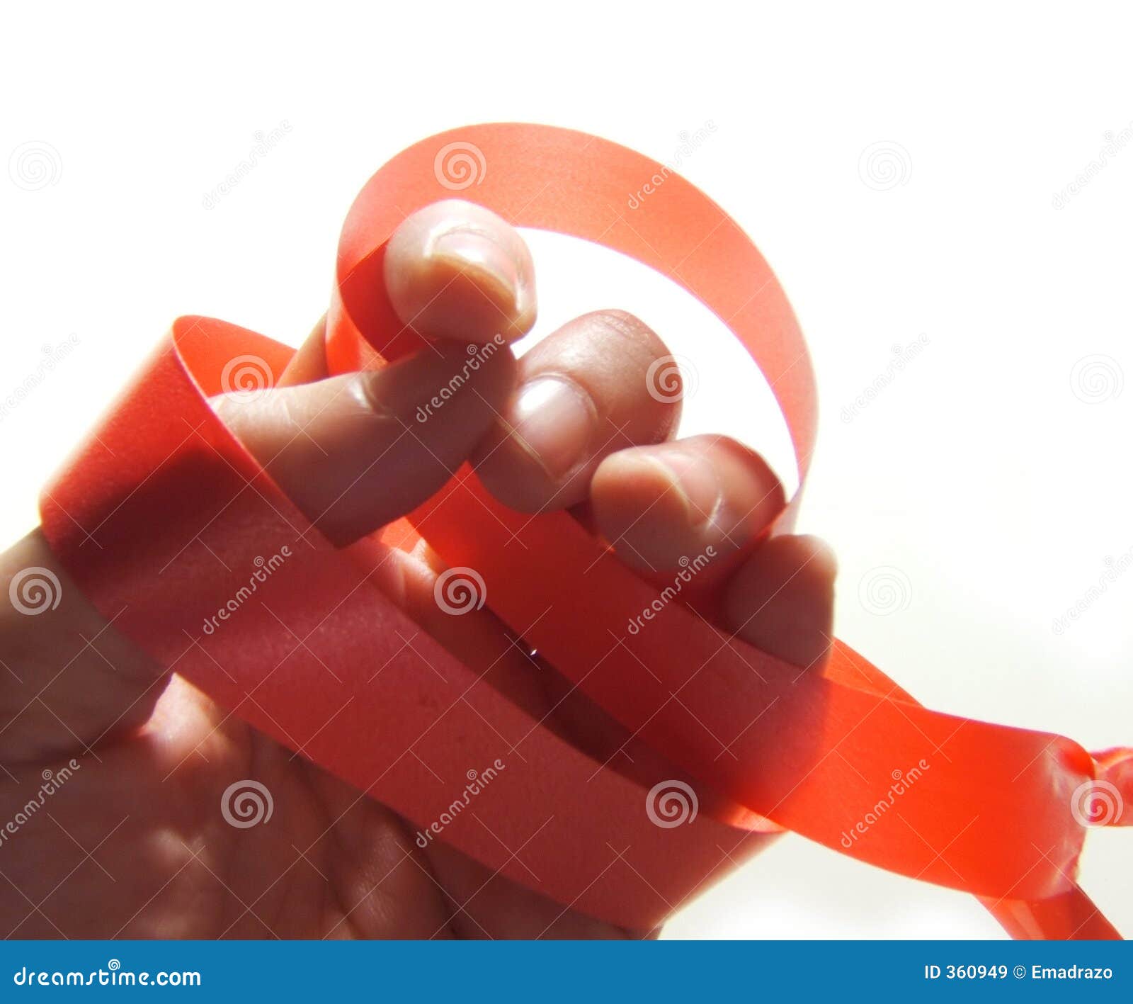 Hand holding red ribbon stock image. Image of hold, intertwined - 360949