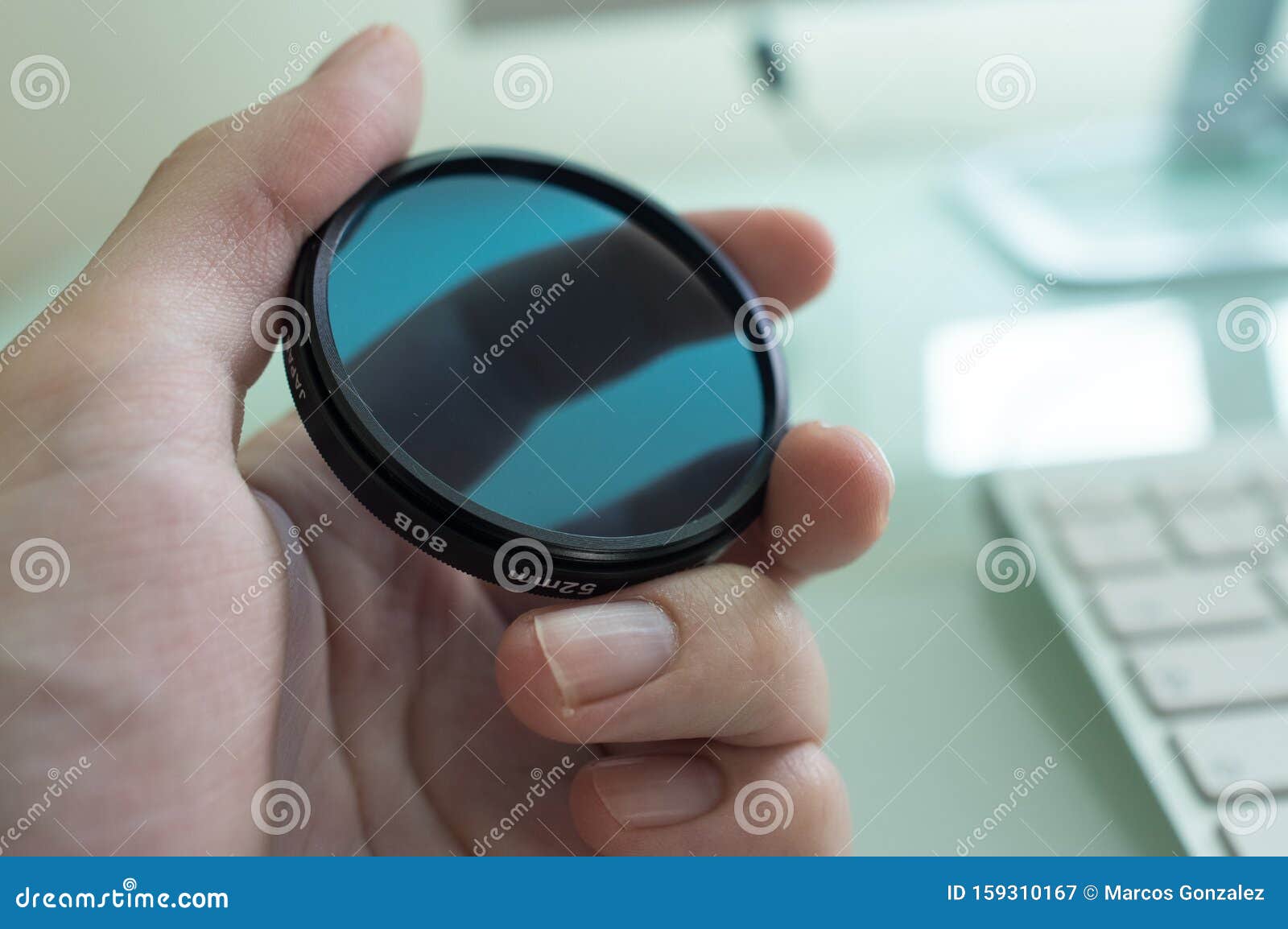 Hand Holding a Reflex Camera Blue Filter Stock Image - Image of depth ...