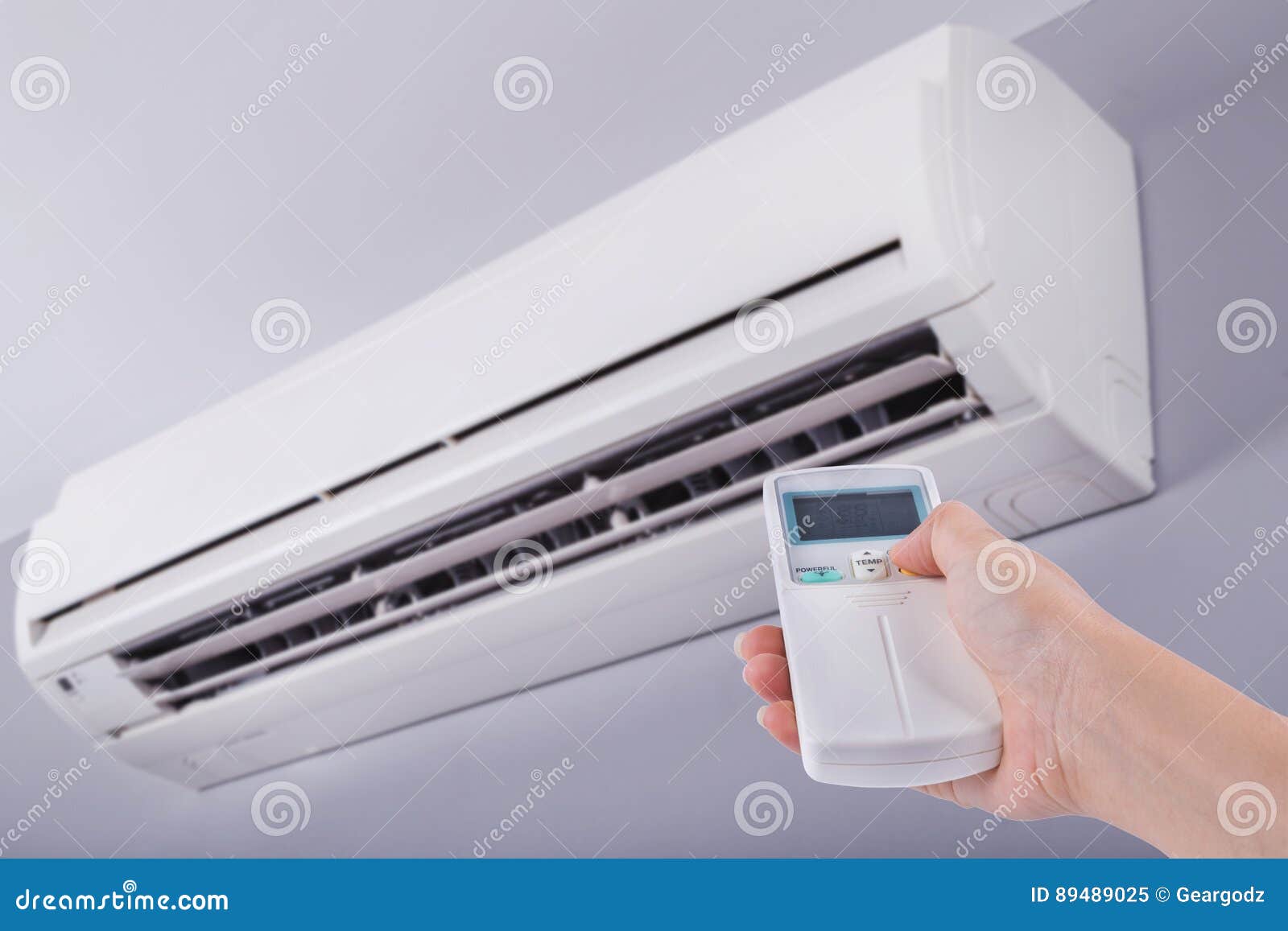 Hand Holding Remote Control Directed on Air Conditioner Stock Image ...