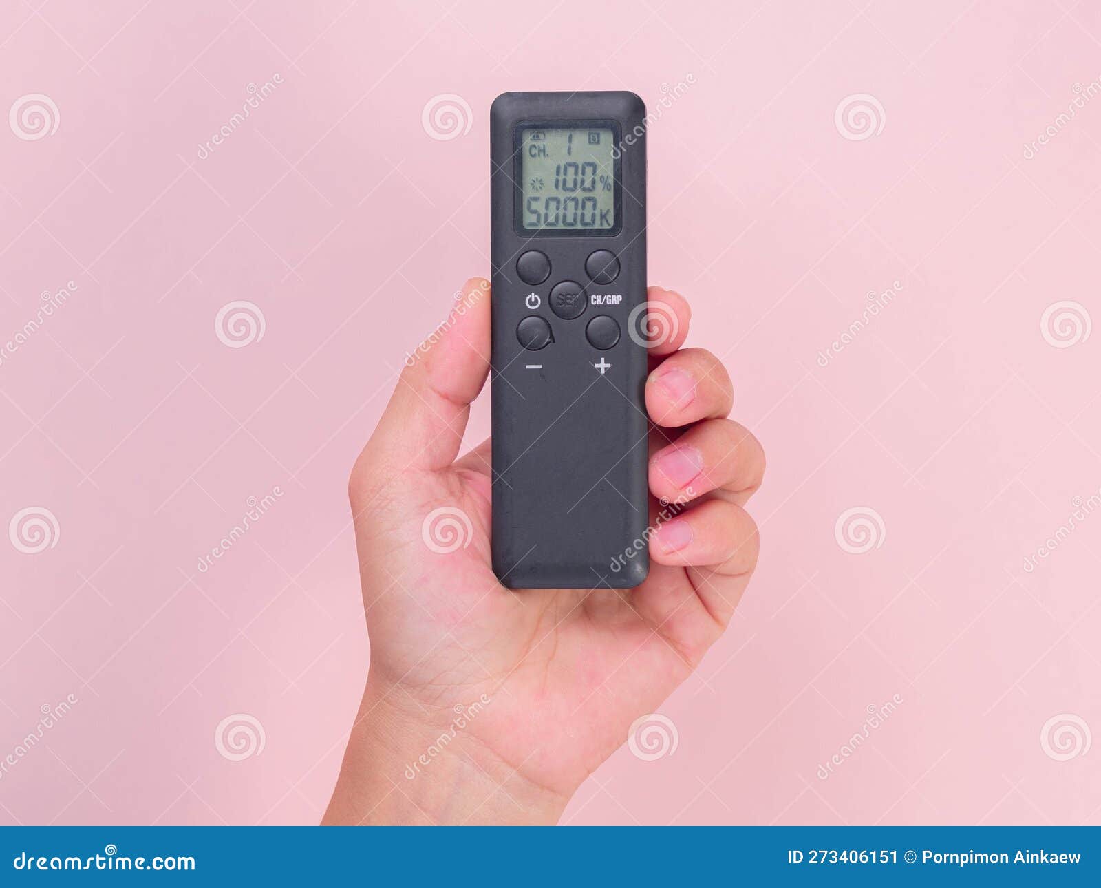 Hand Holding Remote Control Isolated on Pink Background. Remote Control ...