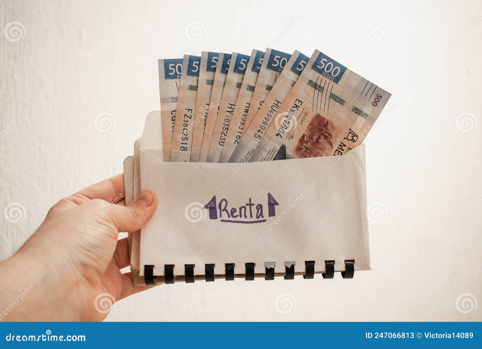 Hand Holding Rent Payment Envelope with Bills Inside. Stock Image ...