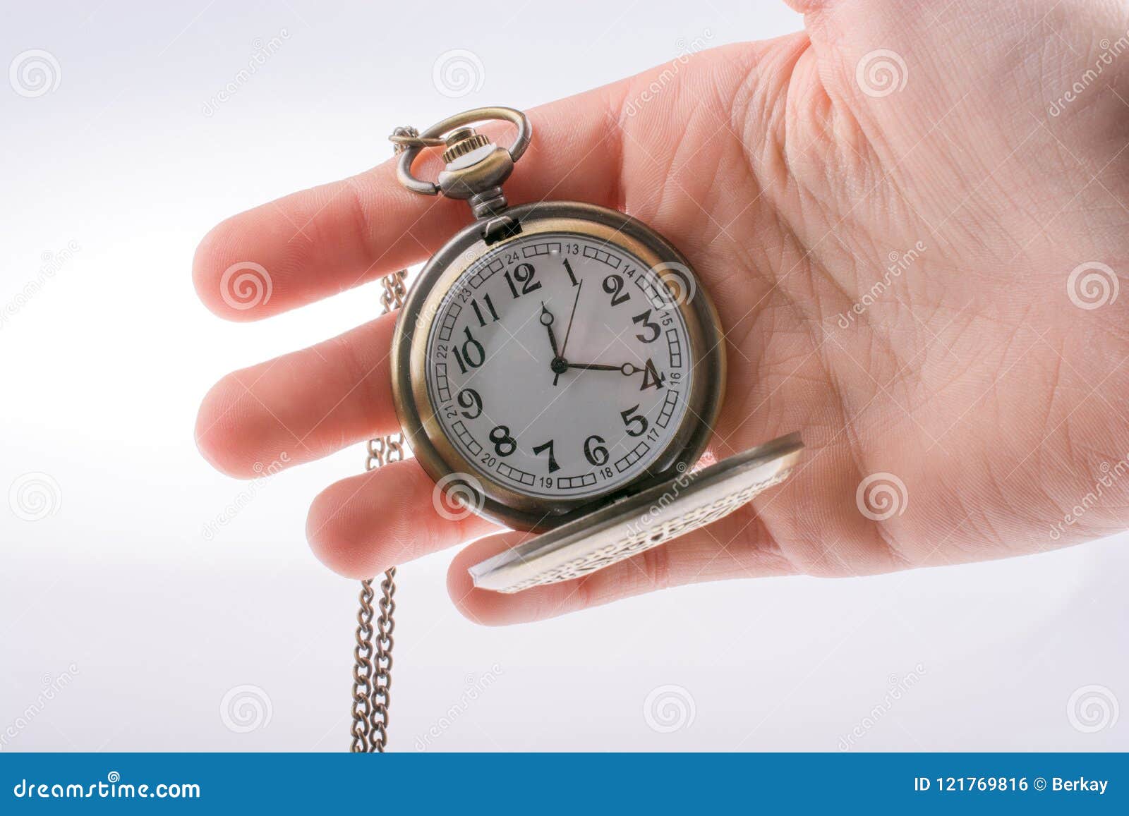 Pocket watch in hand stock photo. Image of ticking, metallic - 121769816