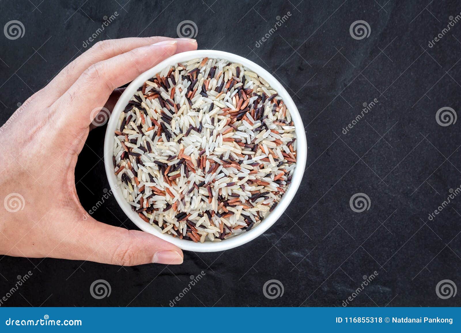 Hand Holding Rice in a Bowl on Black Background Stock Photo - Image of ...