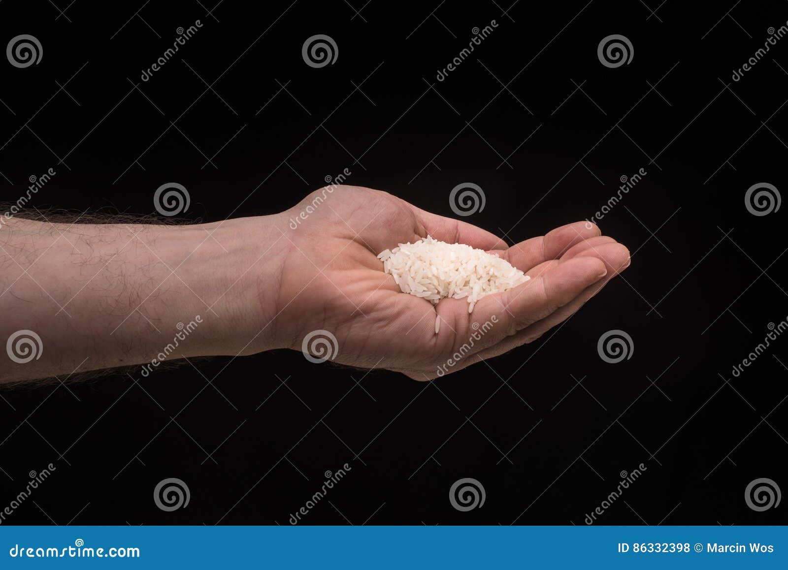 Hand Holding Rice Grain Isolated on Black Background. Stock Photo ...