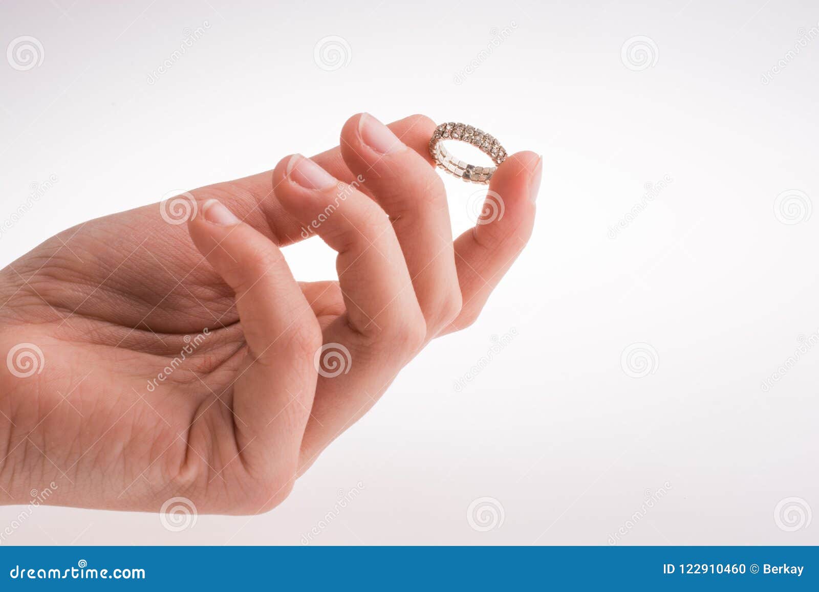 Hand holding ring stock photo. Image of accessorie, ring - 122910460