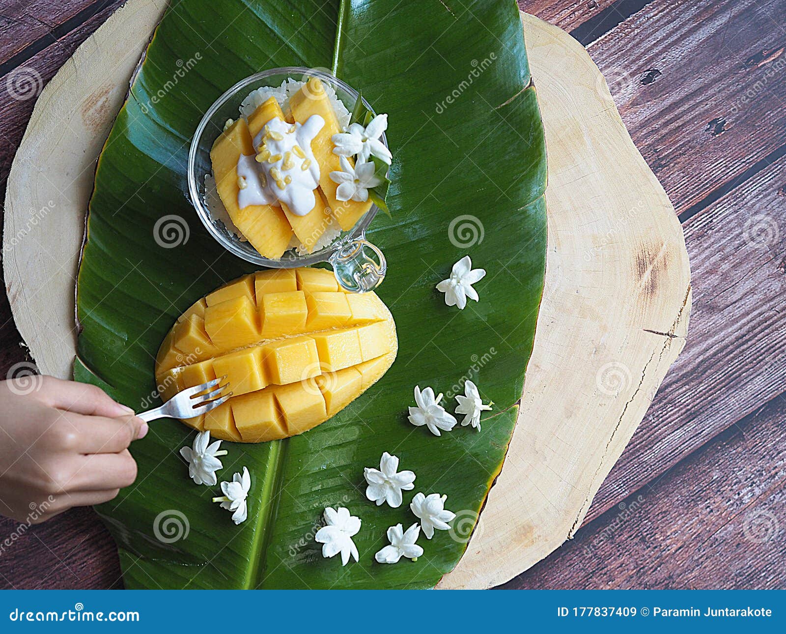 Hand Holding Ripe Mango by a Fork Isolated and Sticky Rice Stock Image ...