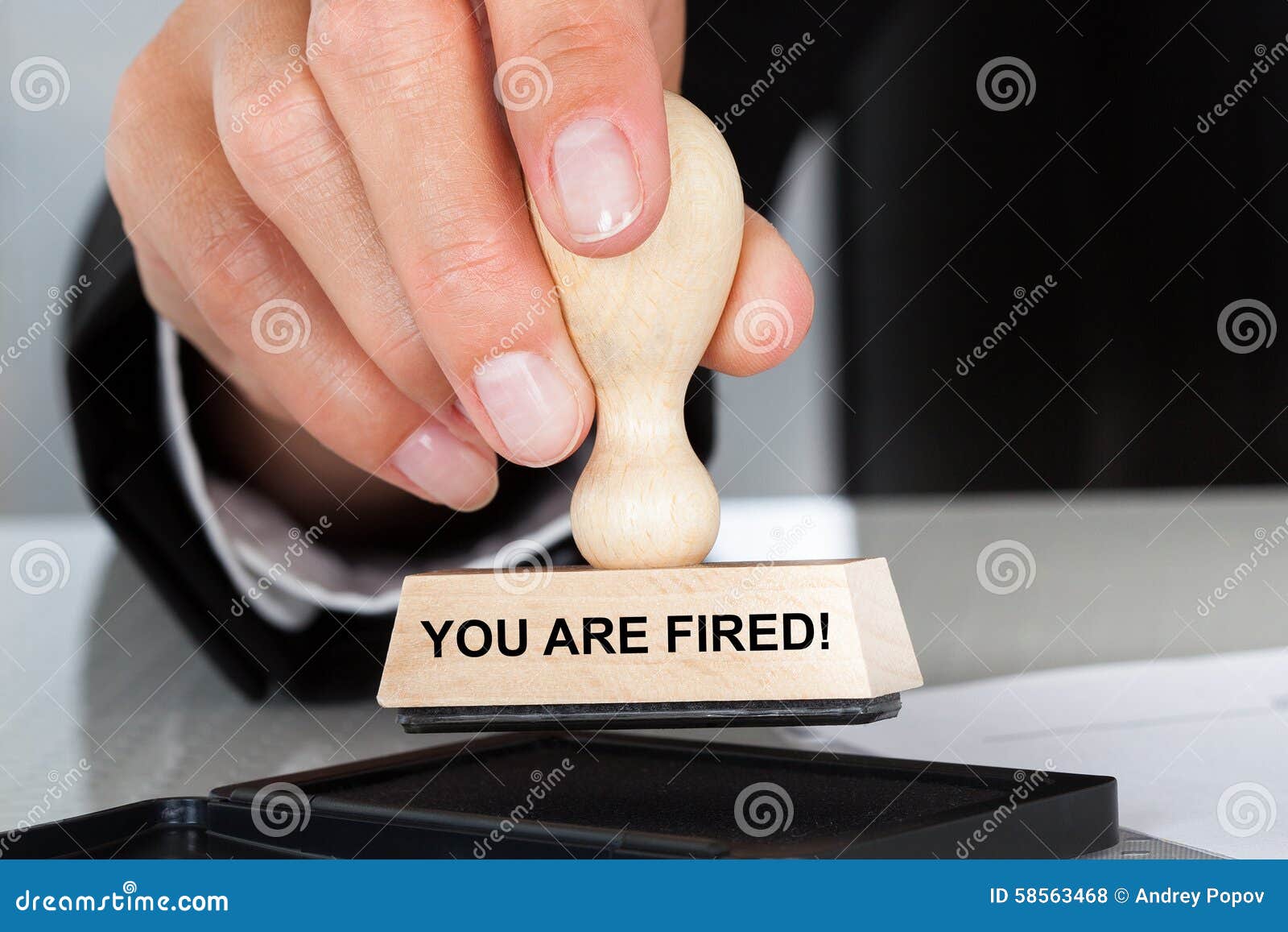 Hand Holding Rubber Stamp With You Are Fired Sign Stock Photo - Image ...
