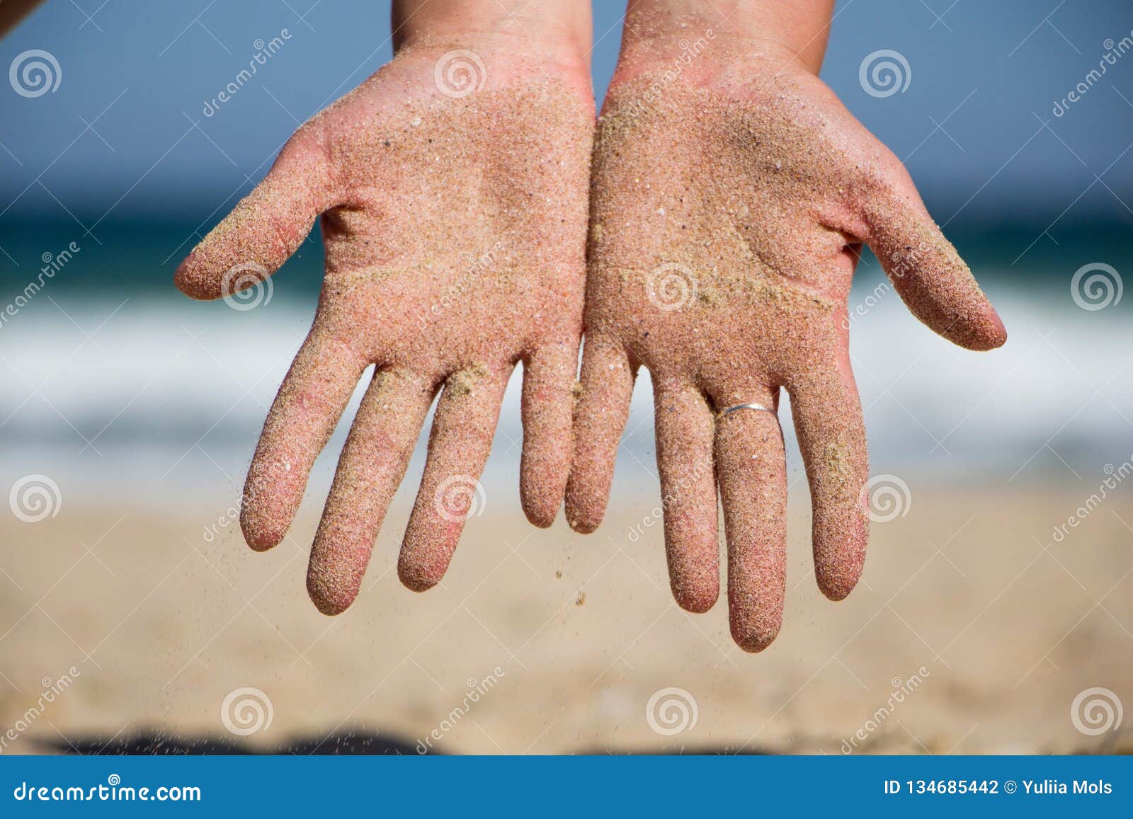 Hand holding sand. stock photo. Image of gently, body - 134685442
