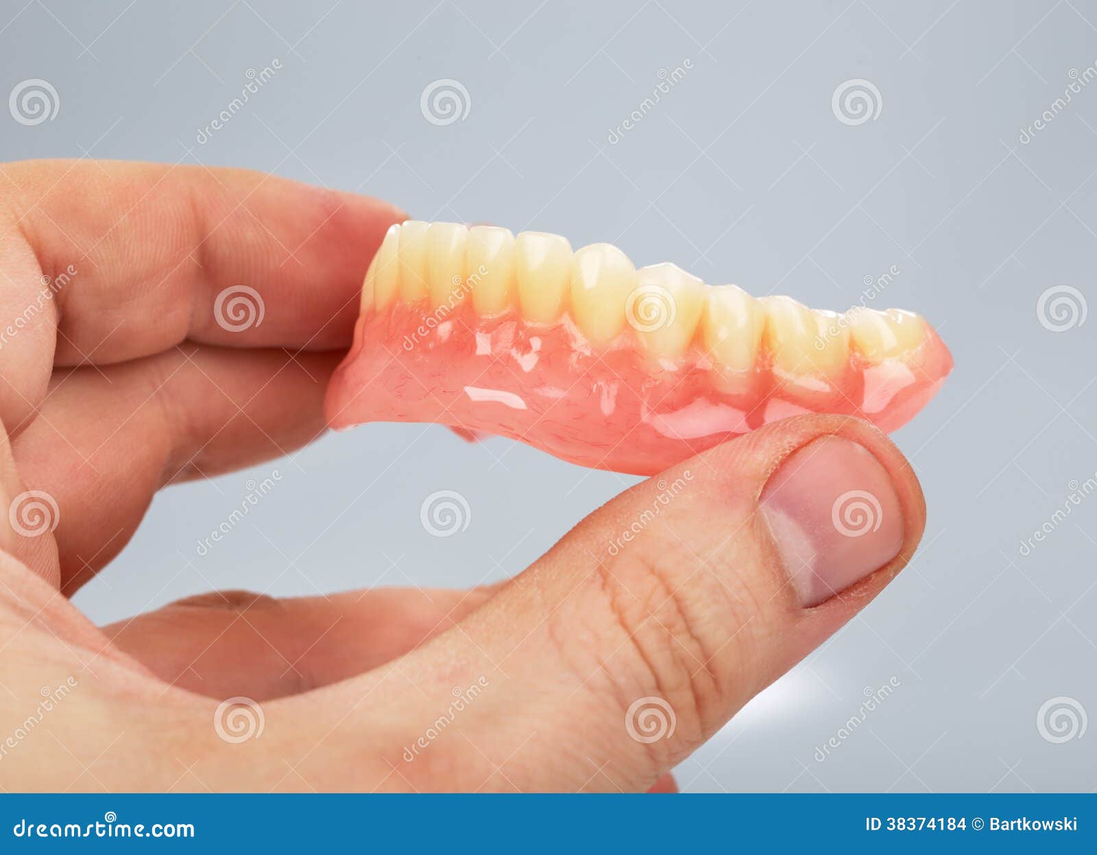 Hand Holding a Set of Dentures Stock Photo - Image of hygiene, dental ...