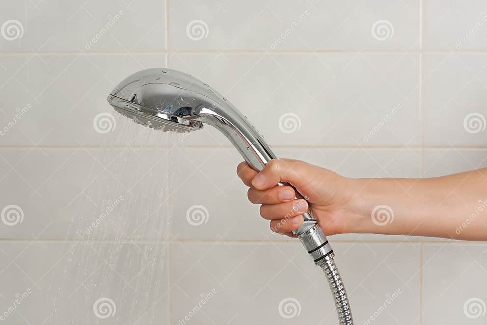 Hand holding the shower stock photo. Image of clean, liquid - 10071528