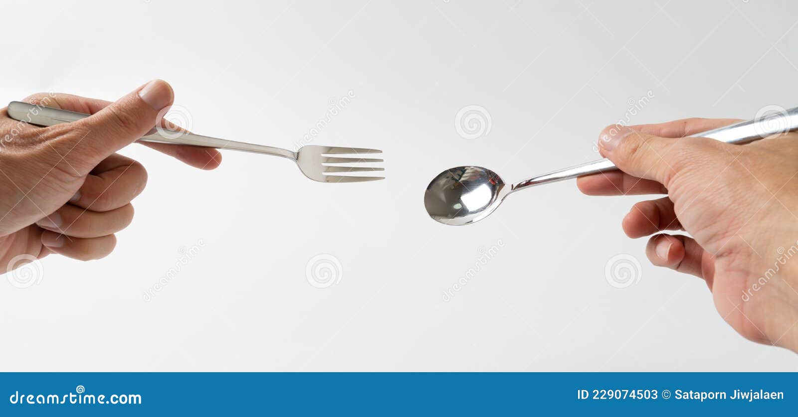 Hand Holding Silver Fork and Spoon on White Stock Image - Image of ...