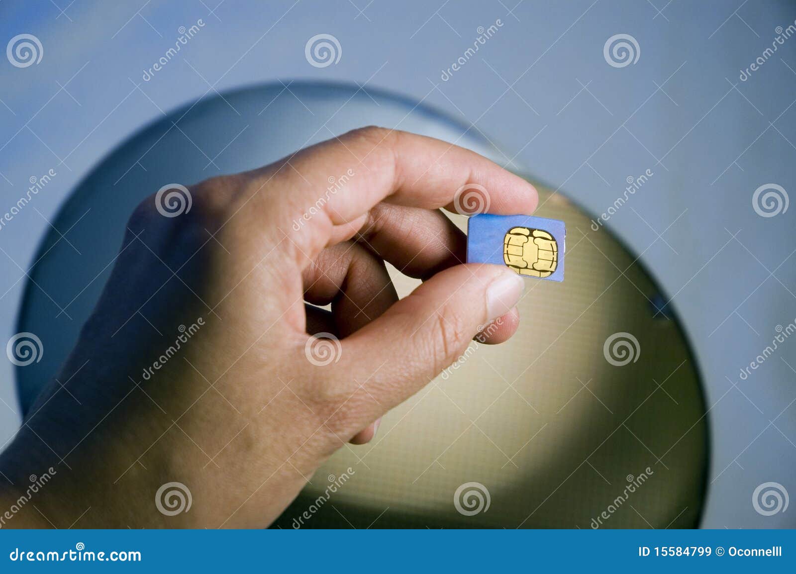 Hand Holding SIM Module Over Silicon Wafers Stock Image - Image of laser, matter: 15584799