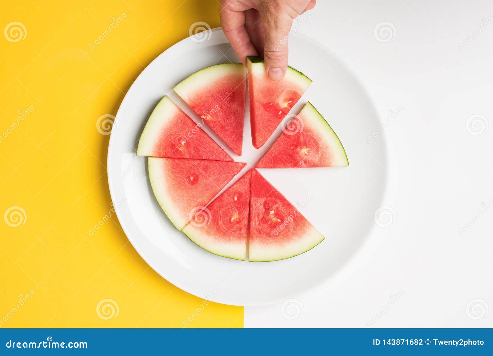 Hand Holding Slice of Watermelon Over Split Color Background Stock ...