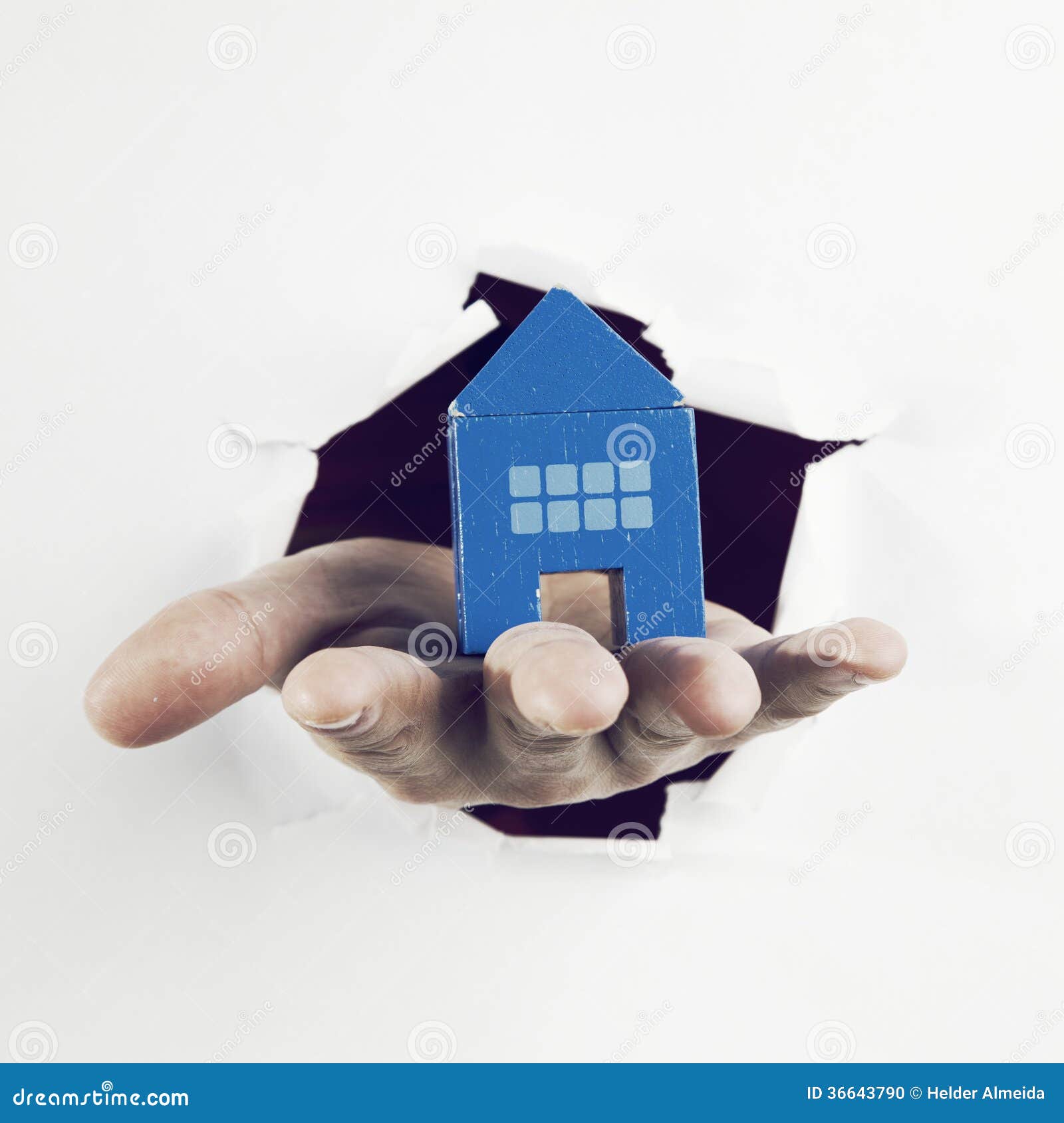 Hand holding a small house stock photo. Image of assistance - 36643790