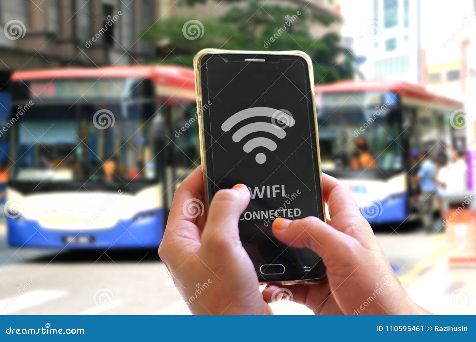 Hand Holding Smart Phone at Bus Stop Stock Image - Image of modern ...