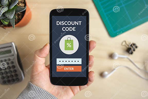 Hand Holding Smart Phone with Discount Code Concept on Screen Stock ...
