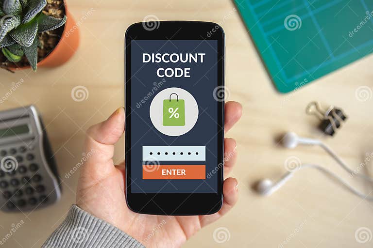 Hand Holding Smart Phone with Discount Code Concept on Screen Stock ...