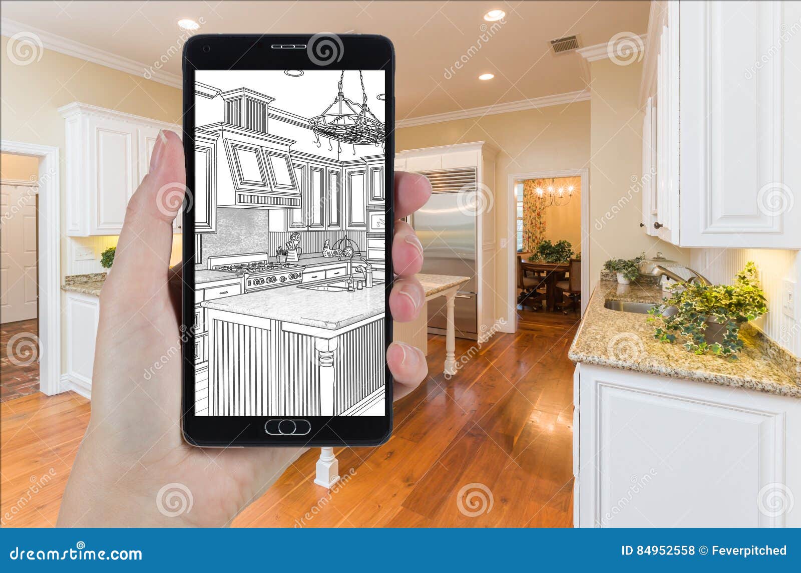 Hand Holding Smart Phone Displaying Drawing of Kitchen Photo Behind ...