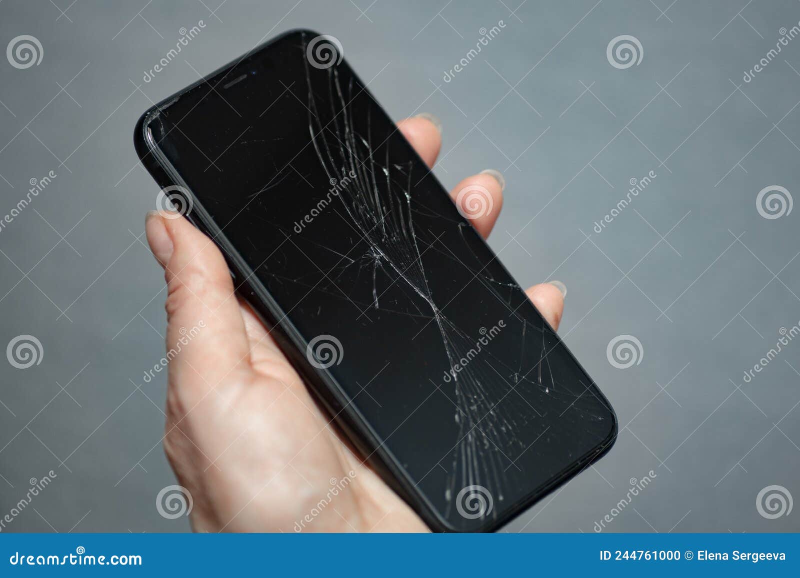 Hand Holding Smartphone with Cracked Screen, Gadget Repair, Selective ...