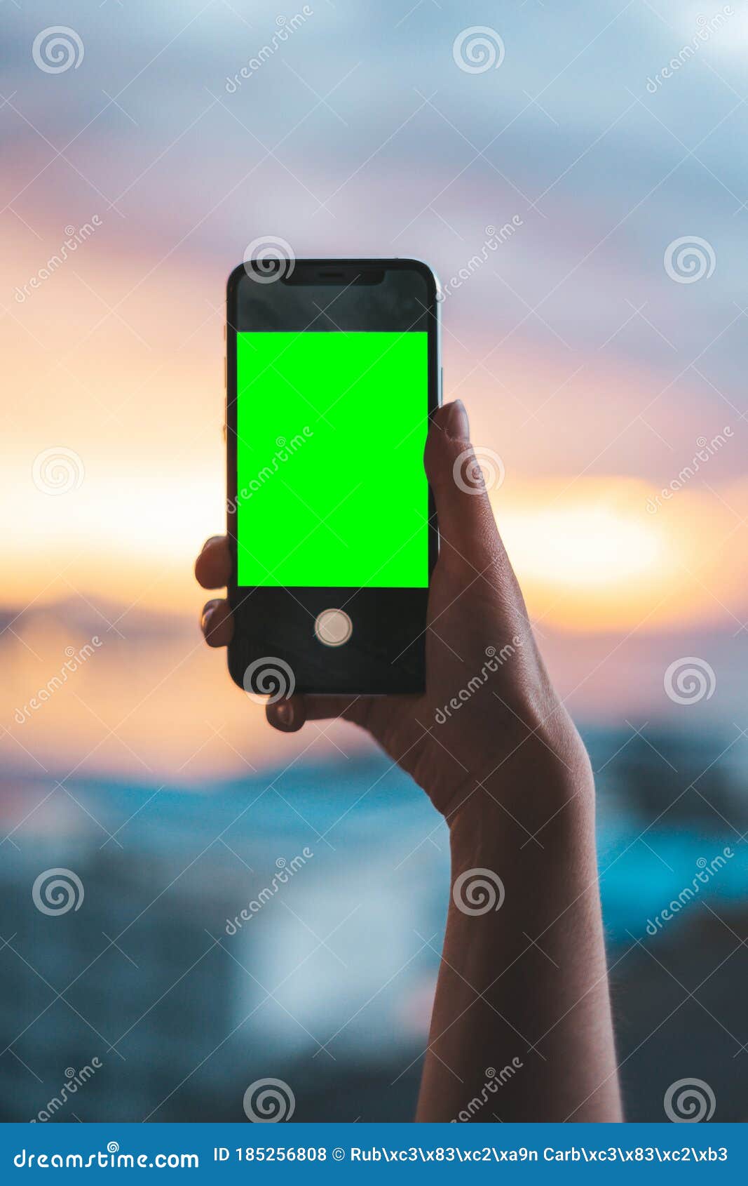 Hand Holding a Smartphone on a Green Screen Stock Photo - Image of ...