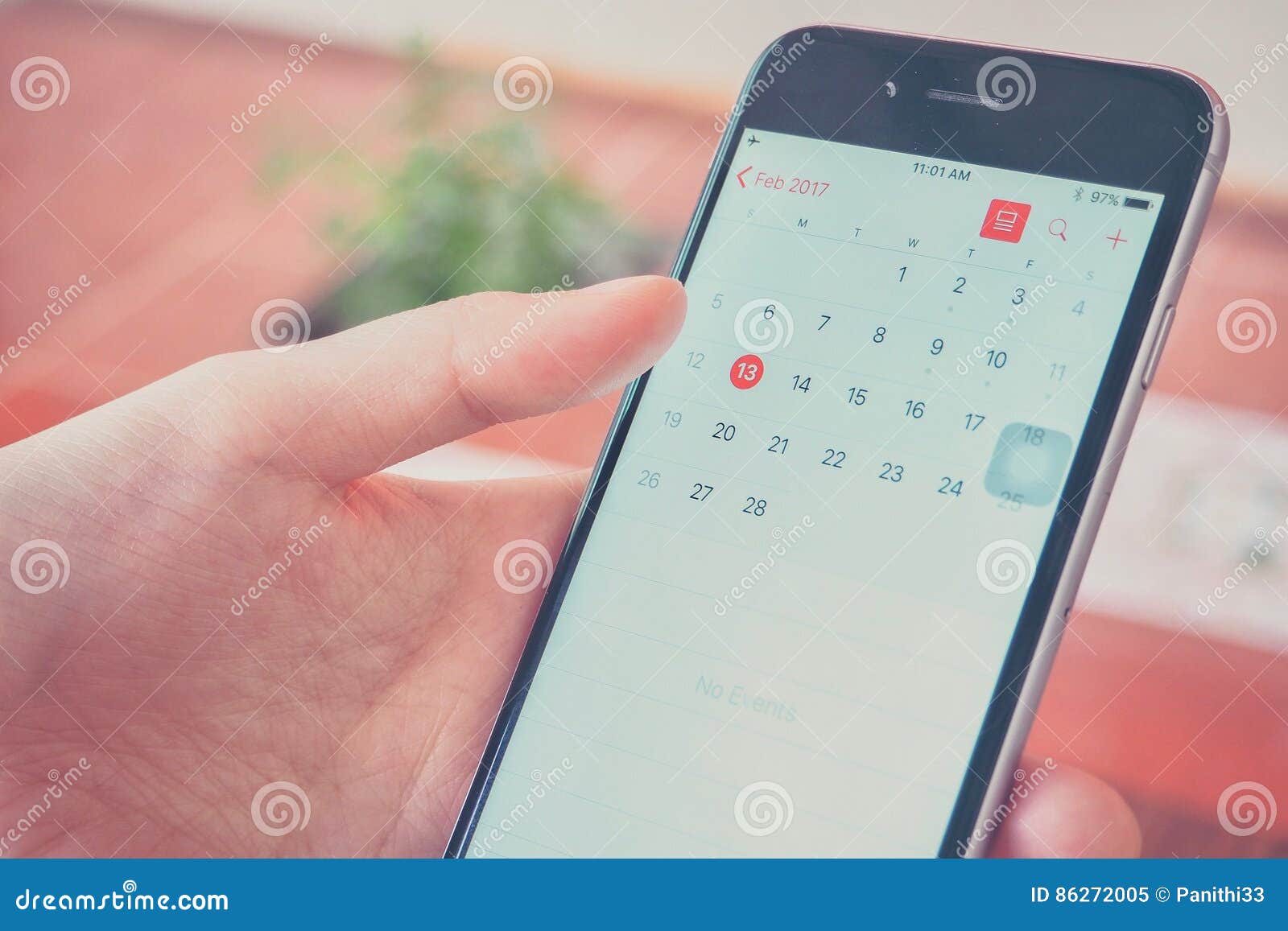 Hand Holding a Smartphone while Looking at Calendar Editorial Image ...