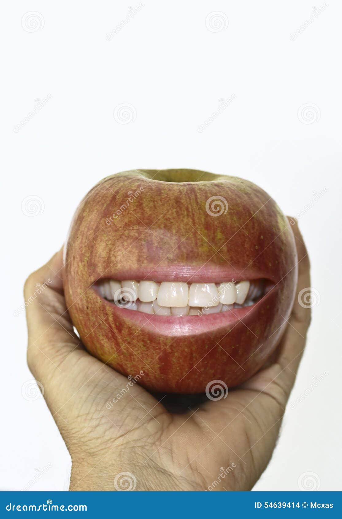 Hand Holding a Smiling Apple Stock Photo - Image of drink, smiling ...