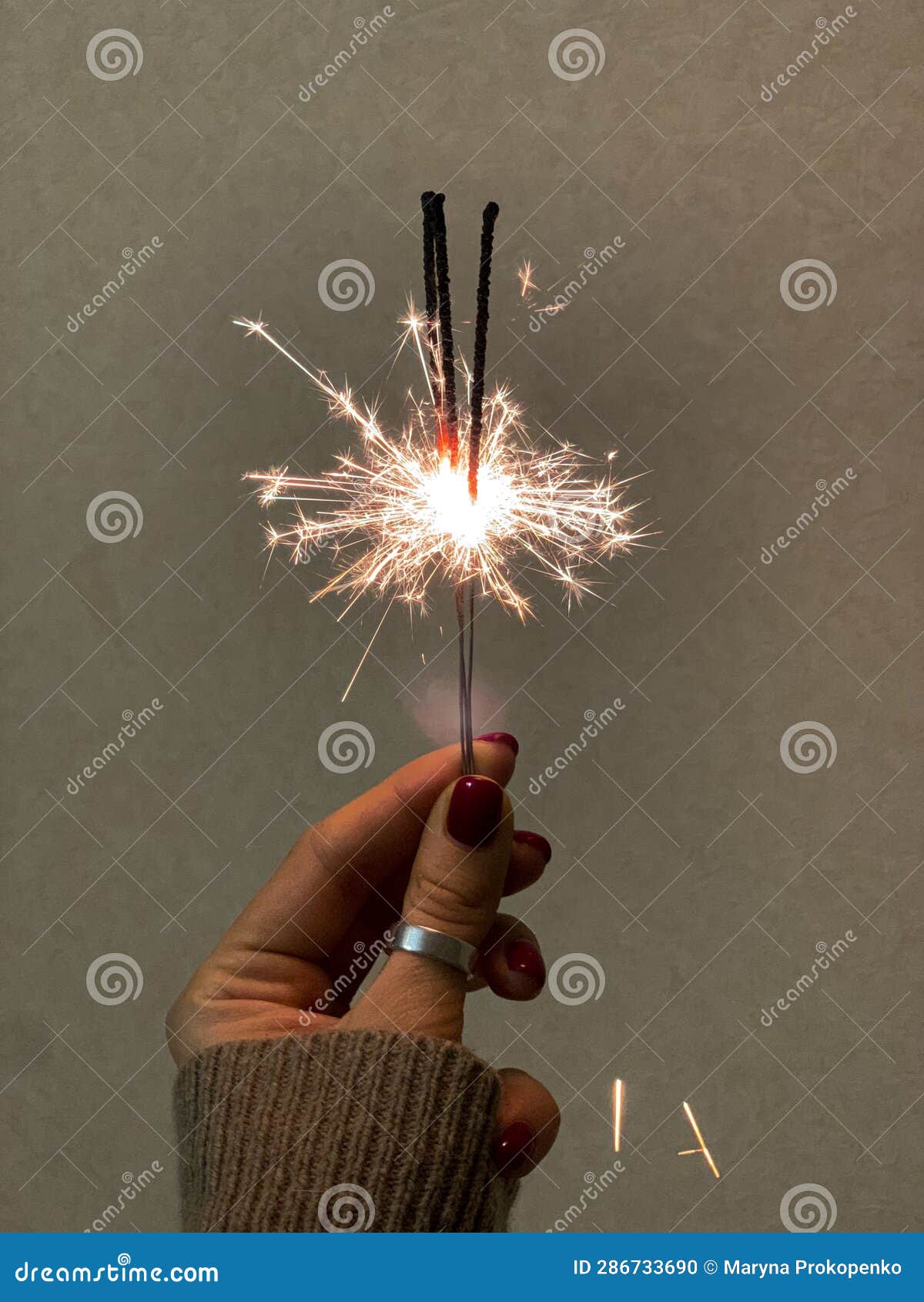 Hand Holding Sparklers on a Simple Background Stock Photo - Image of ...