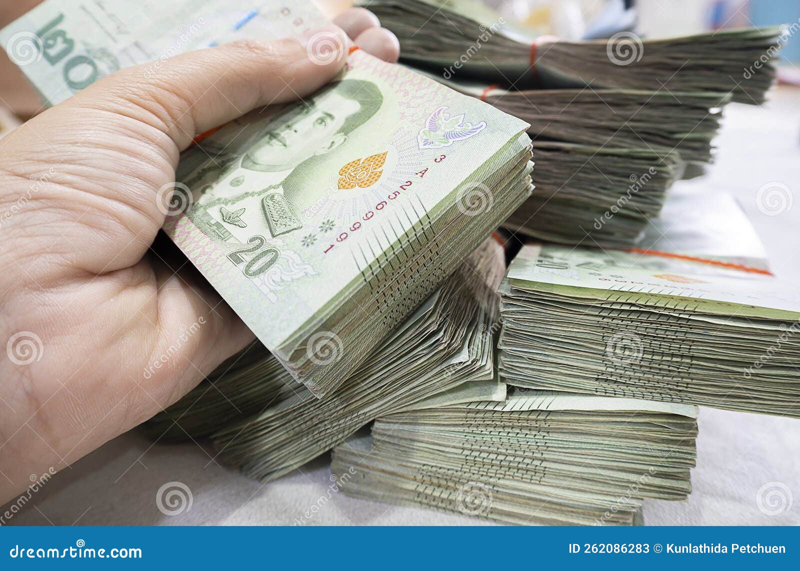 Hand Holding Stack of Many Thai Money, Hand Giving Thai Money on Table ...