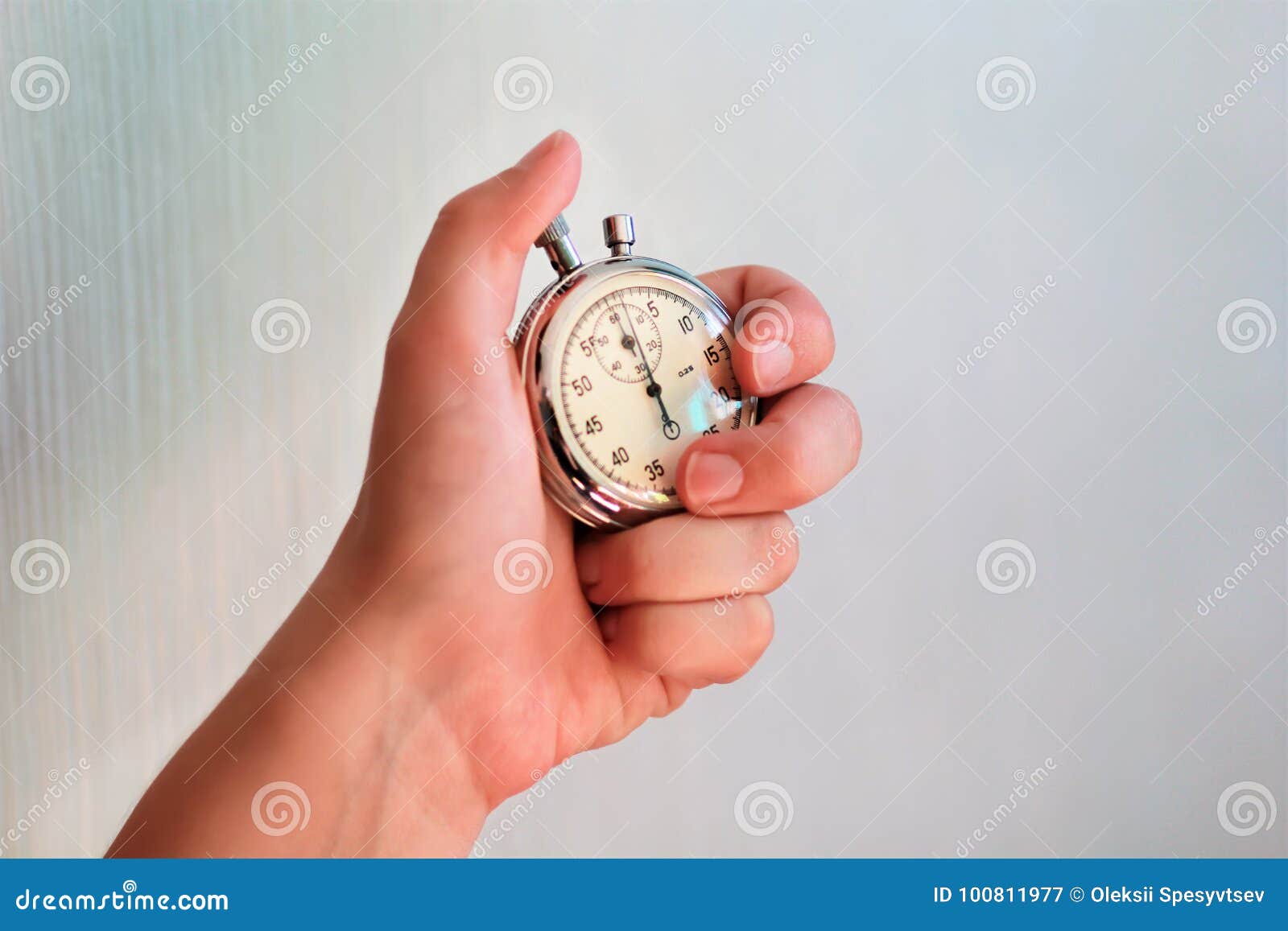 Hand Holding a Stopwatch and Pressing the Button To Note the Time ...