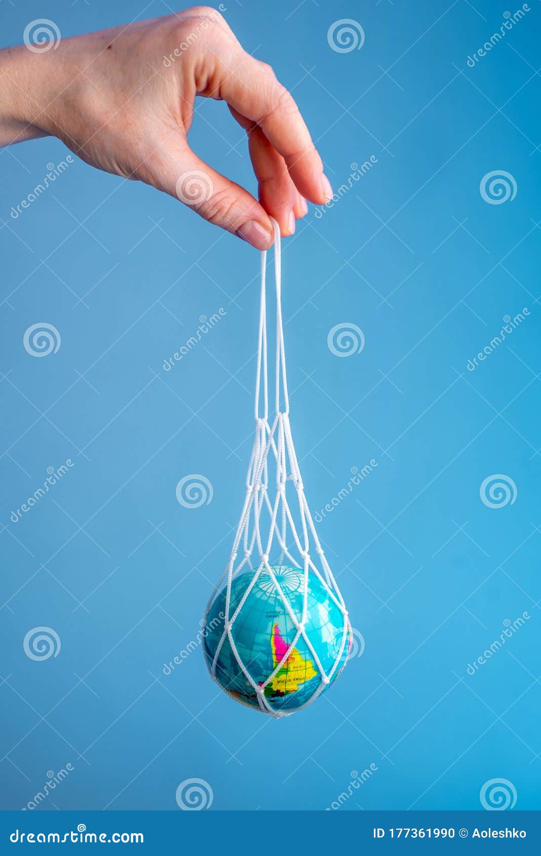 Hand Holding a String Bag with the Planet Earth. Caring for the ...