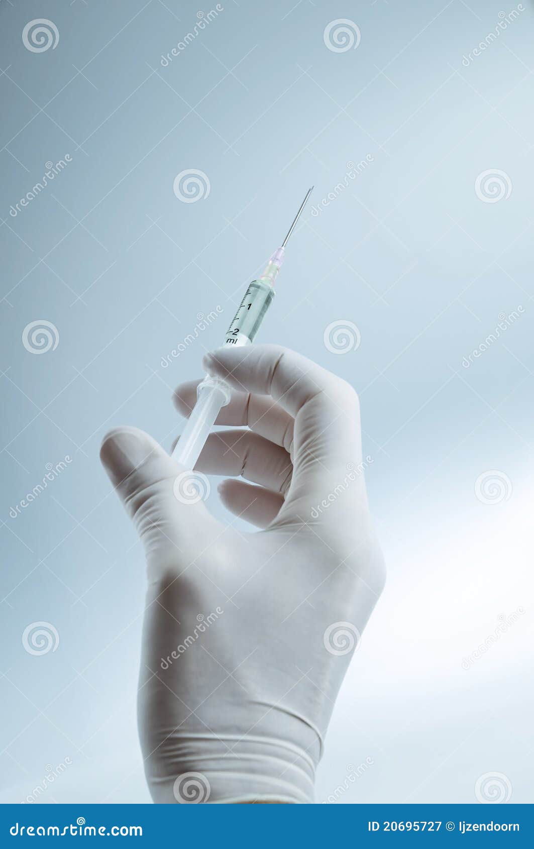 Hand holding syringe stock image. Image of medicine, liquid - 20695727