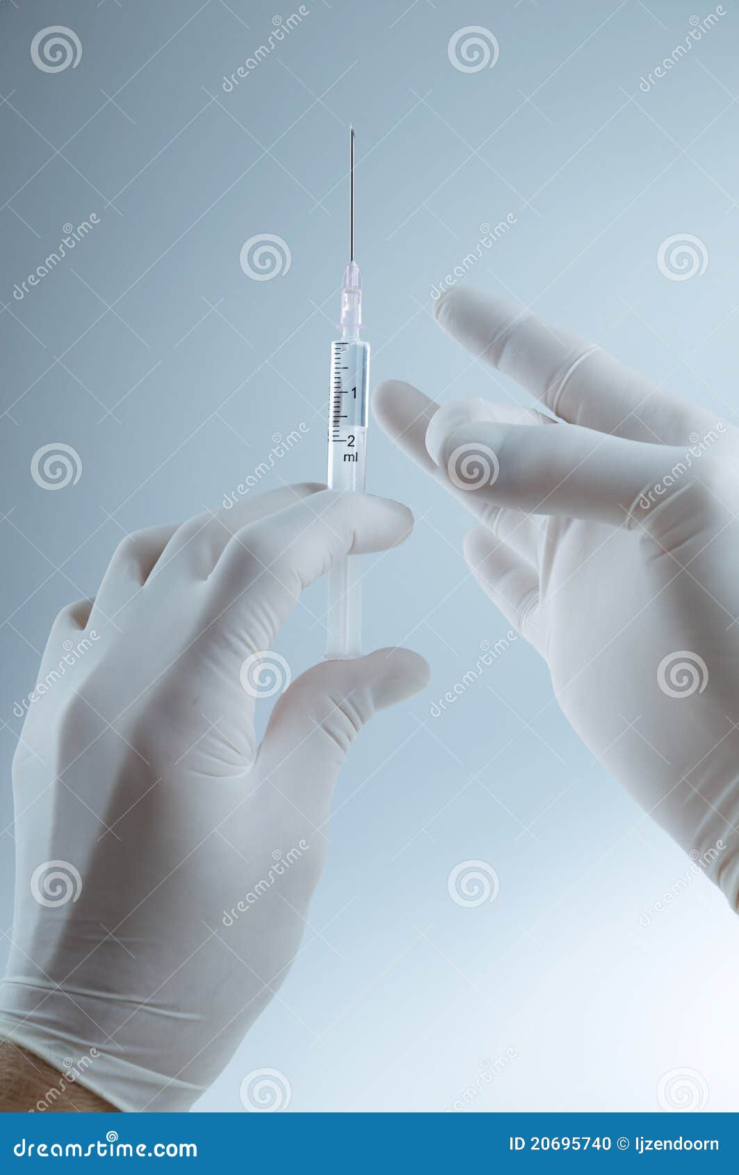 Hand holding syringe stock photo. Image of needle, health - 20695740