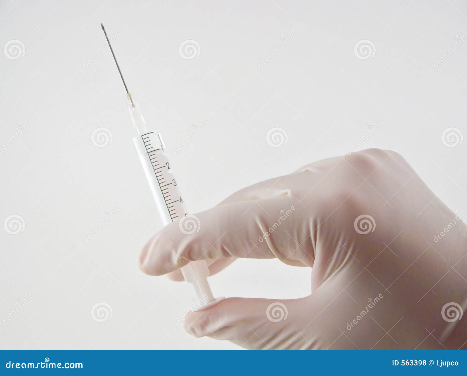 Hand holding a syringe stock photo. Image of cell, medicine - 563398