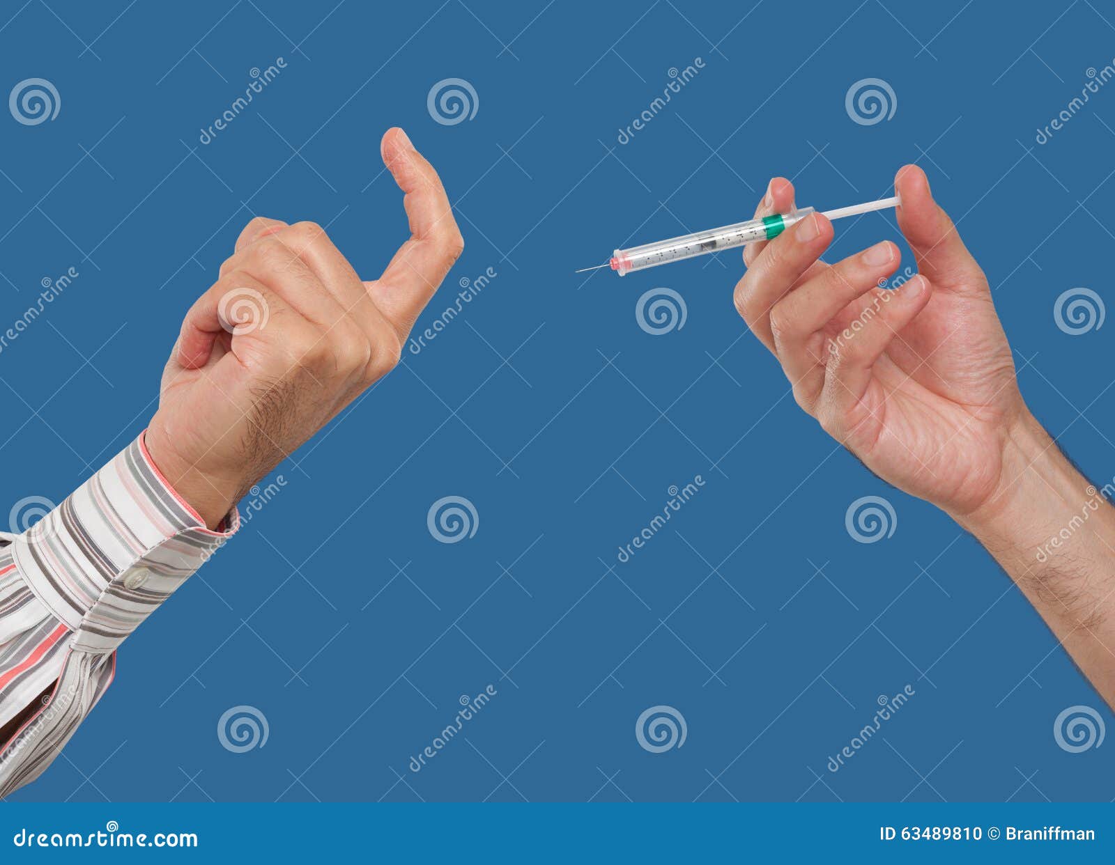 Hand holding a syringe stock photo. Image of finger, hand - 63489810