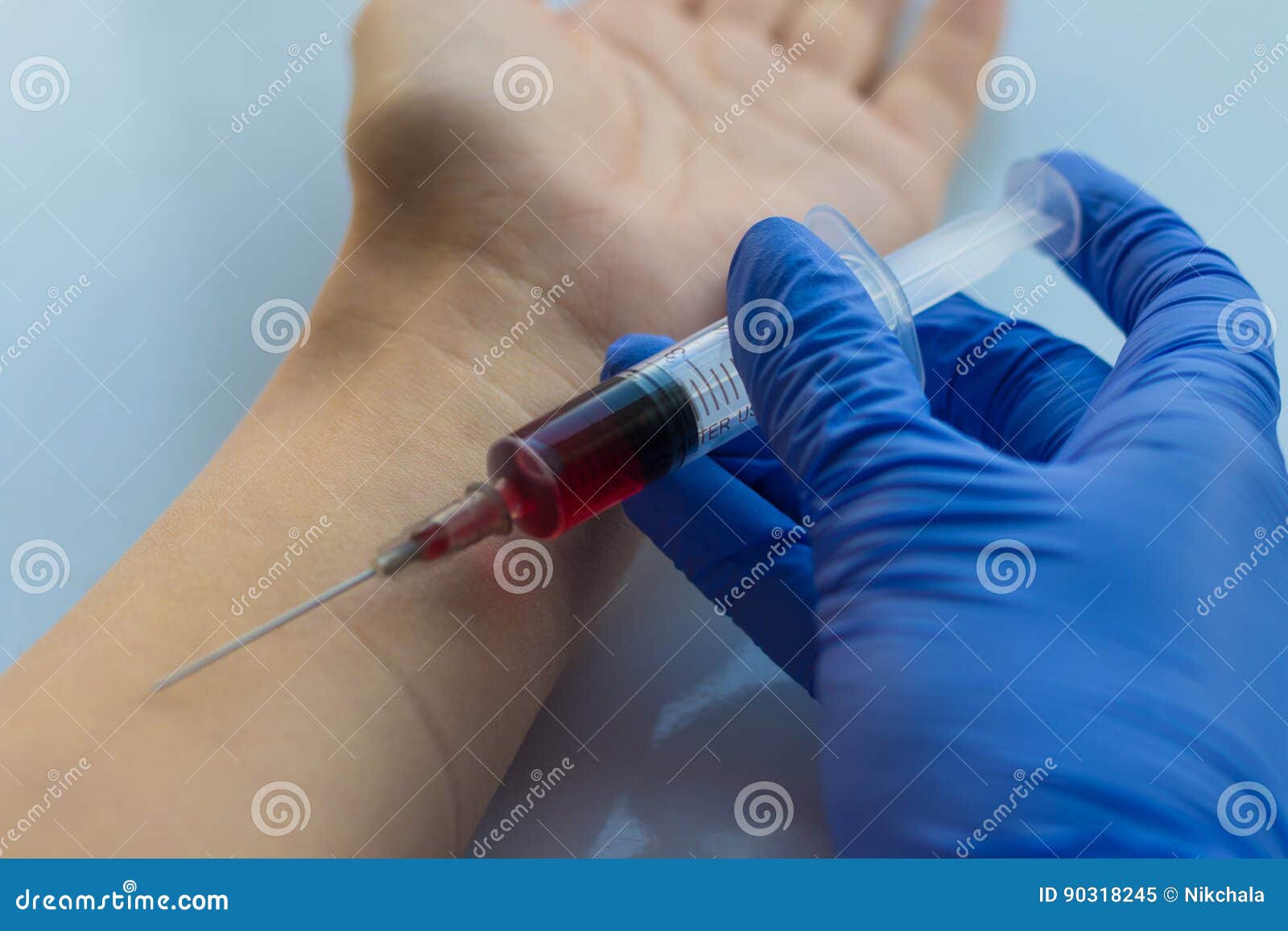 Hand Holding Syringe Filled with Red Liquid. on White. Stock Image ...