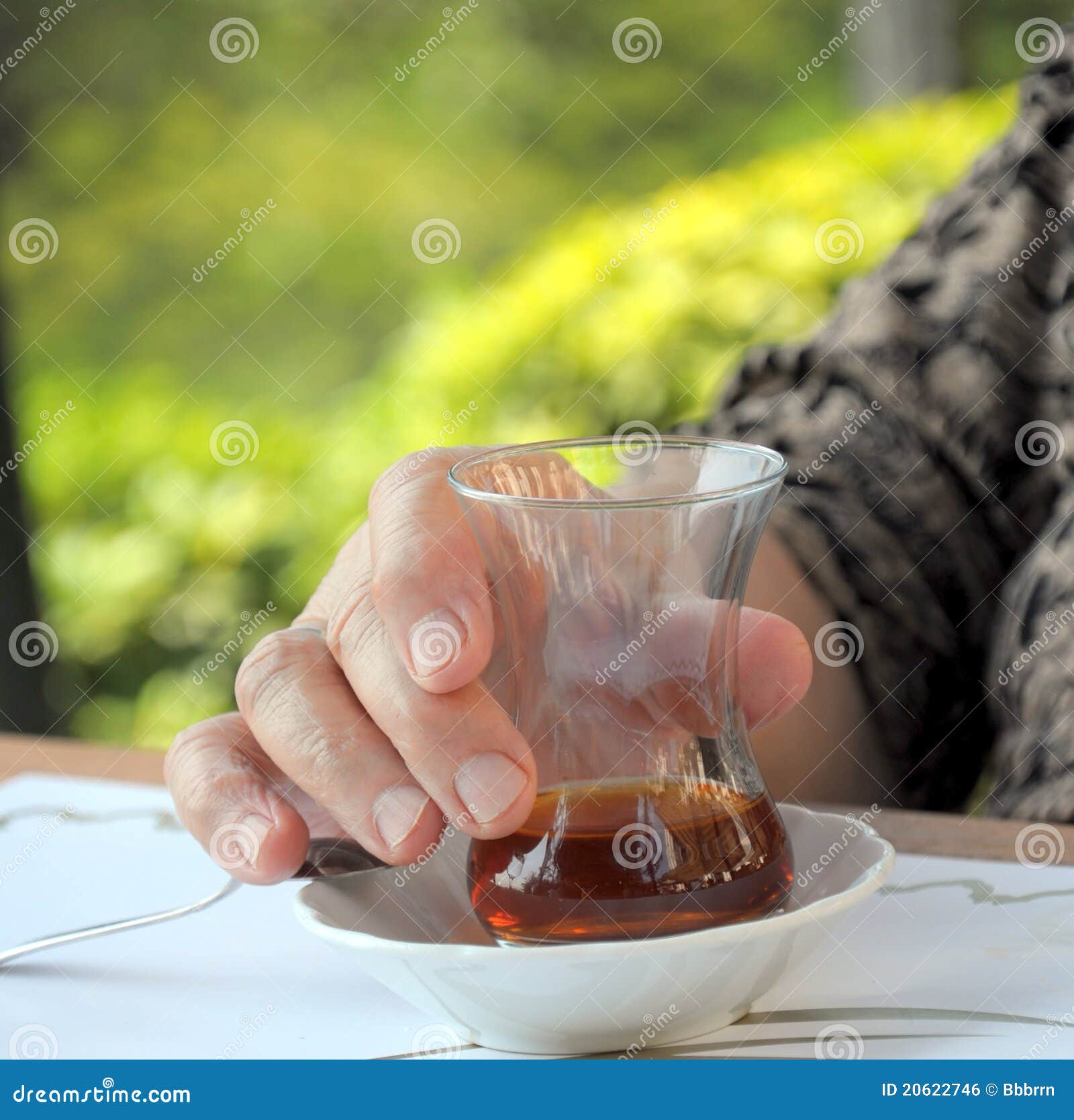 Hand holding tea glass stock photo. Image of black, herbal - 20622746