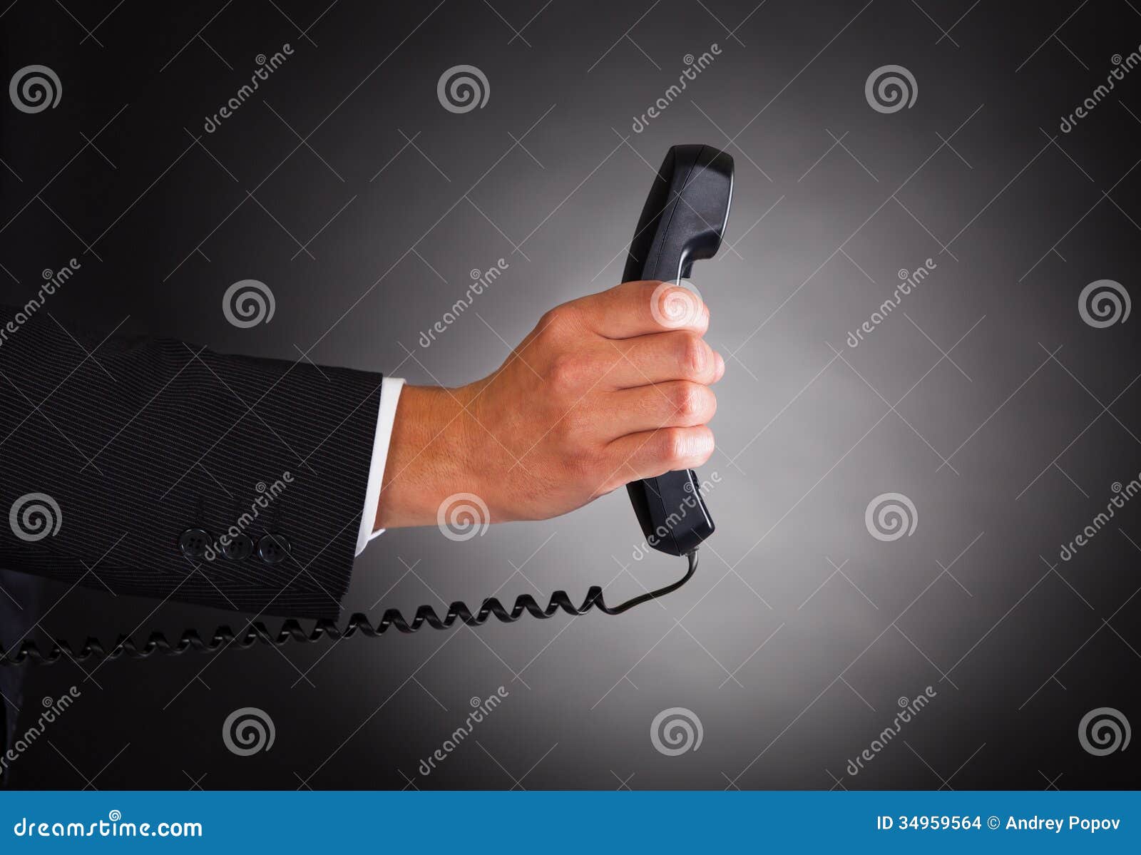 Hand Holding Telephone Receiver Over Black Background Stock Photo ...