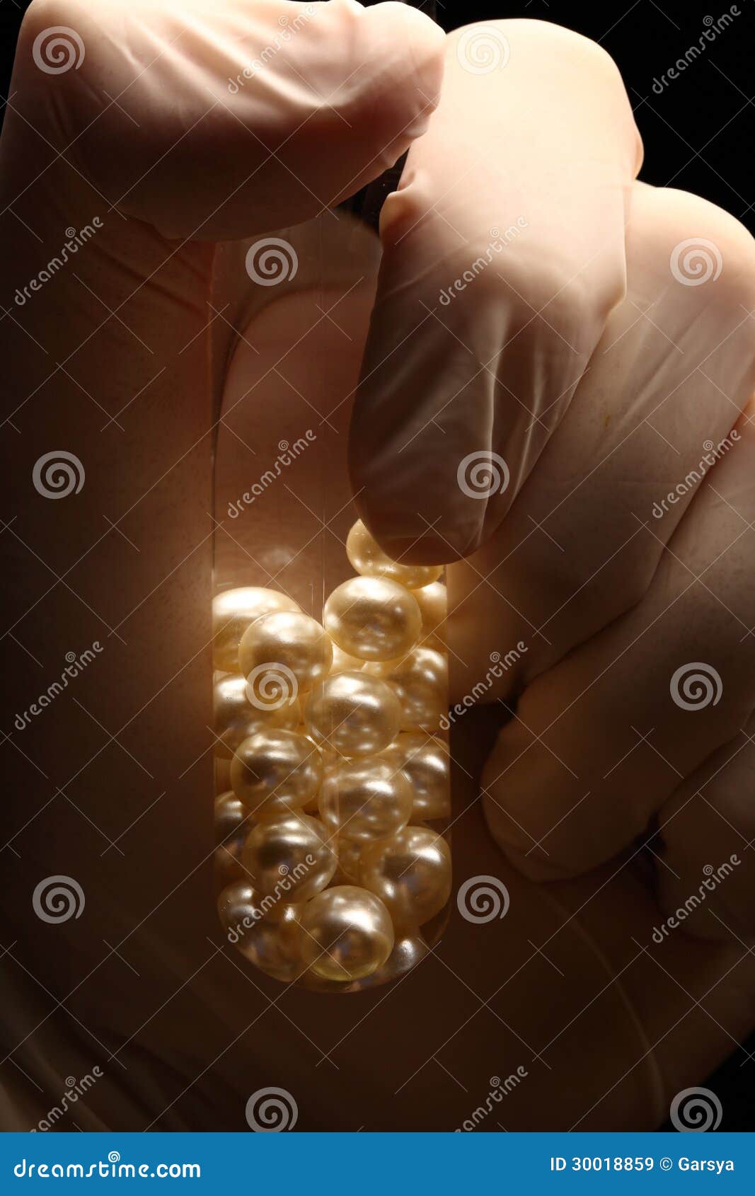 Pearls in tube stock image. Image of glove, biology, holding - 30018859