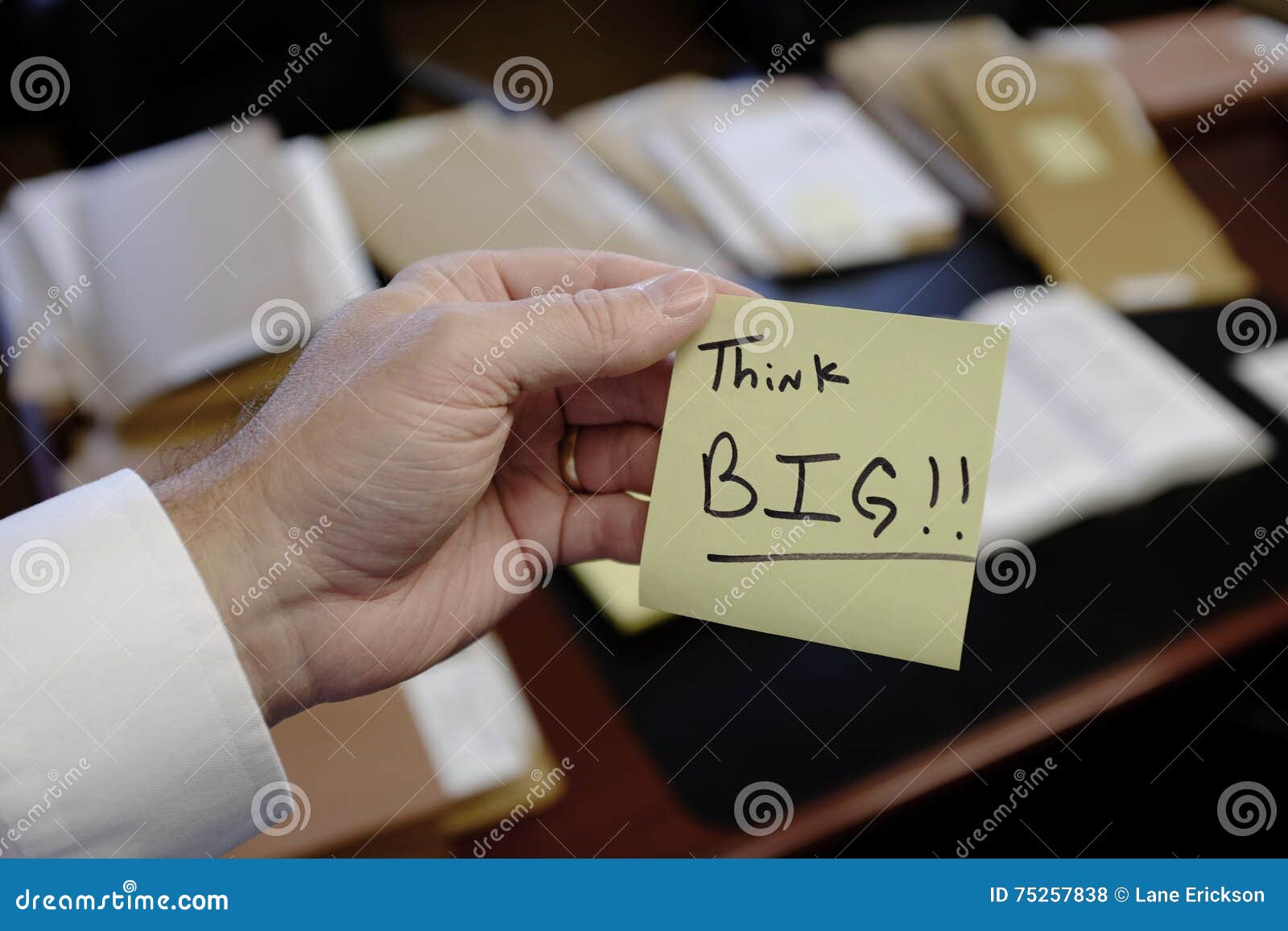 Hand Holding Think Big Sticky Note Stock Photo - Image of place, number ...